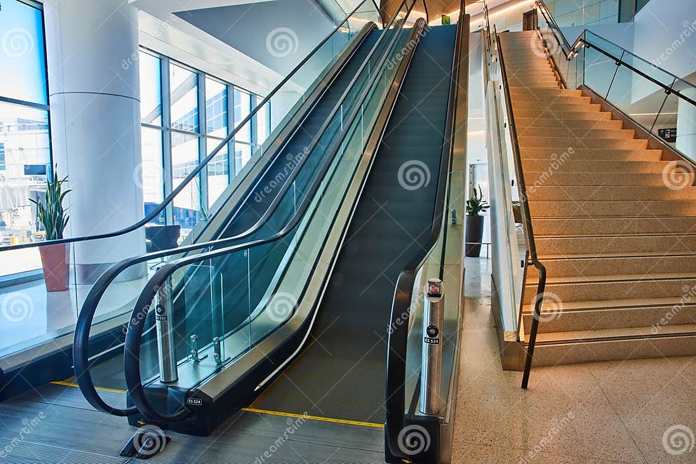 Ascending View of Two Escalators beside Set of Illuminated Stairs in ...