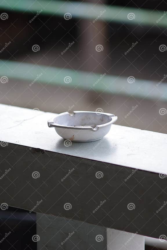Ashtray on the Balcony Railing Stock Image - Image of railing, balcony ...