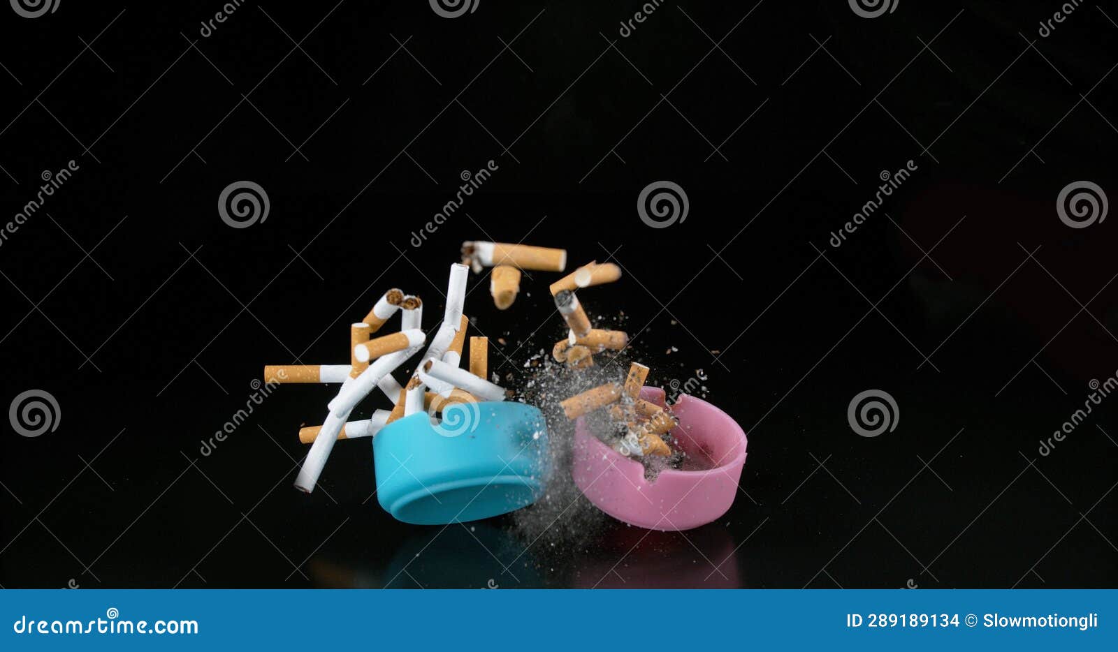 Ashtrays and Cigarettes Falling Against Black Background Stock Photo ...