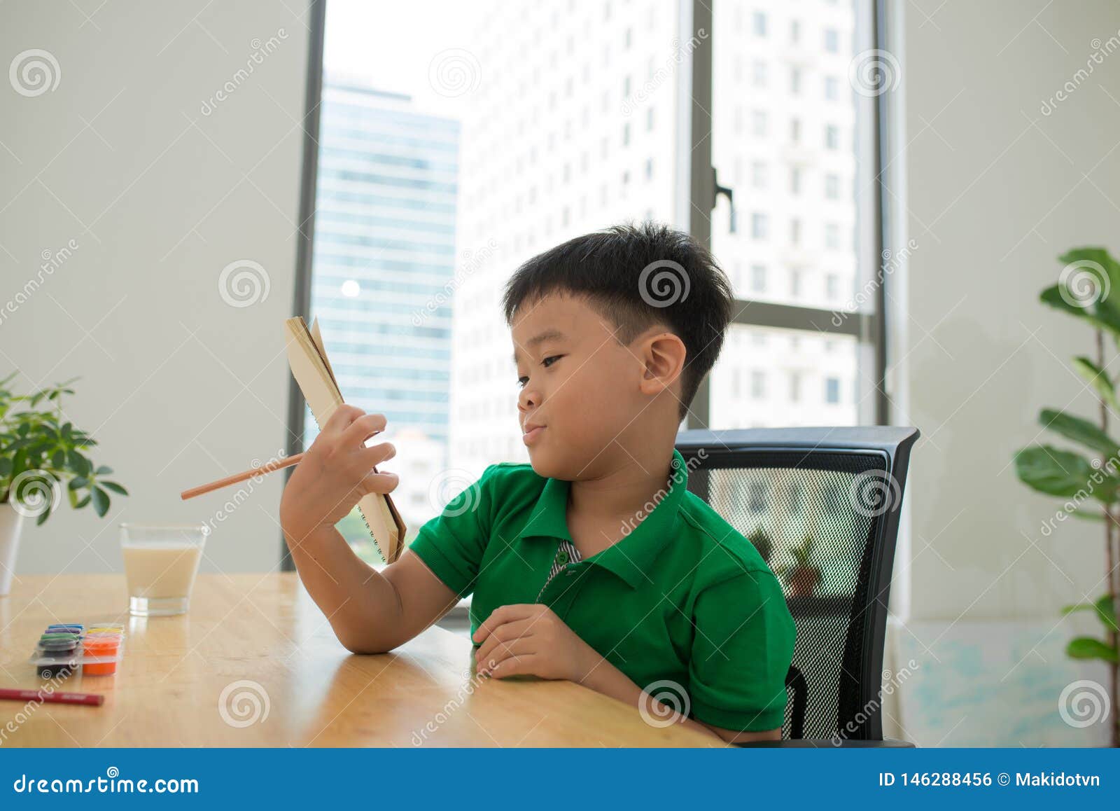 Asia Little Student Boy Studying and Doing His Homework at Home, on the ...