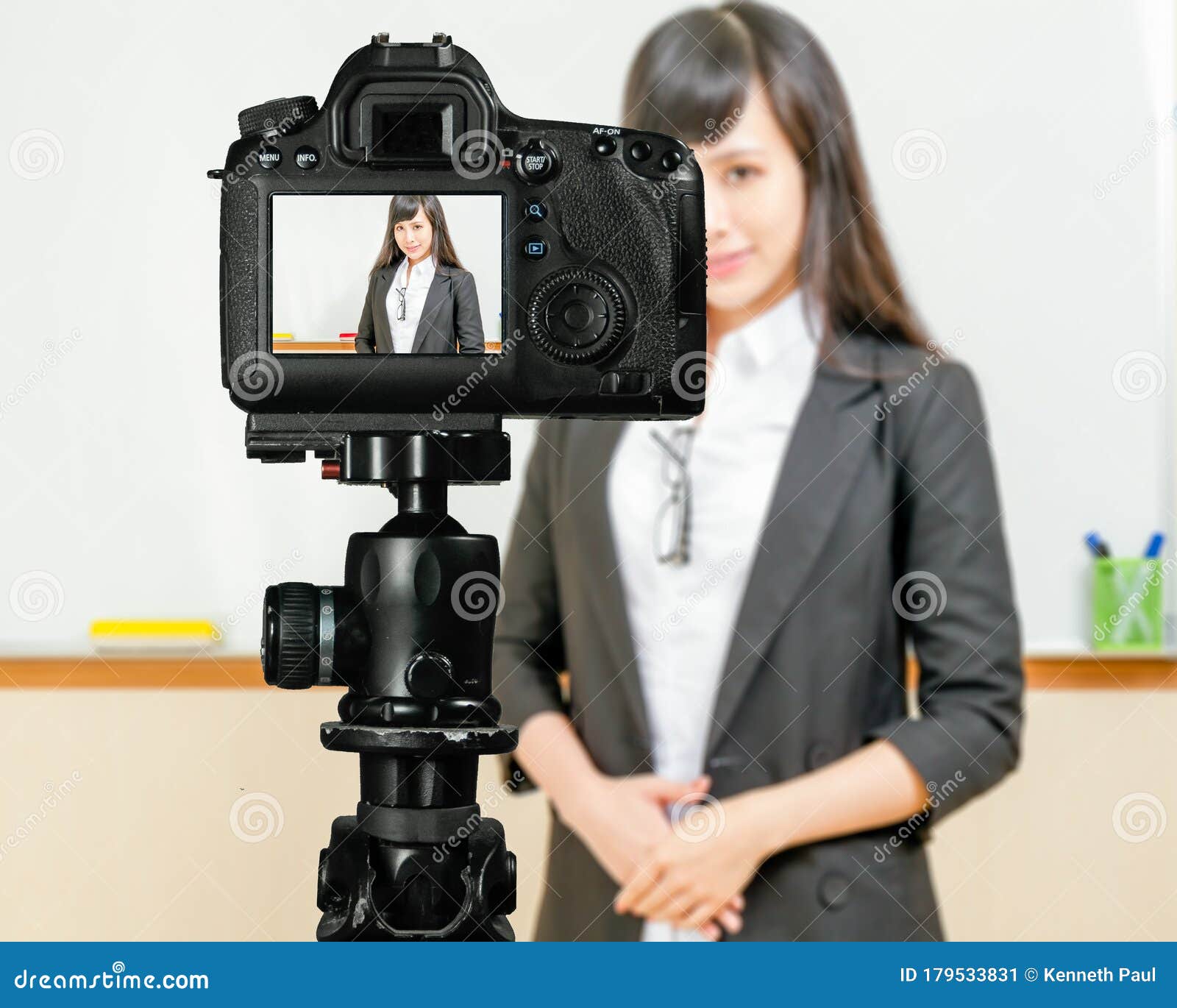 Asian American Teacher Streaming Class with Camera Stock Image - Image ...