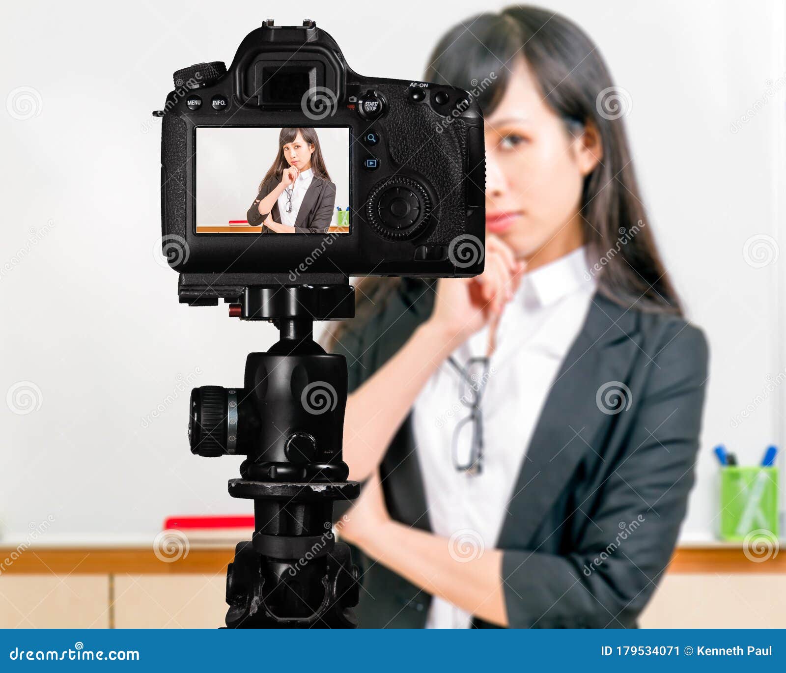 Asian American Teacher Streaming Class with Camera Stock Image - Image ...