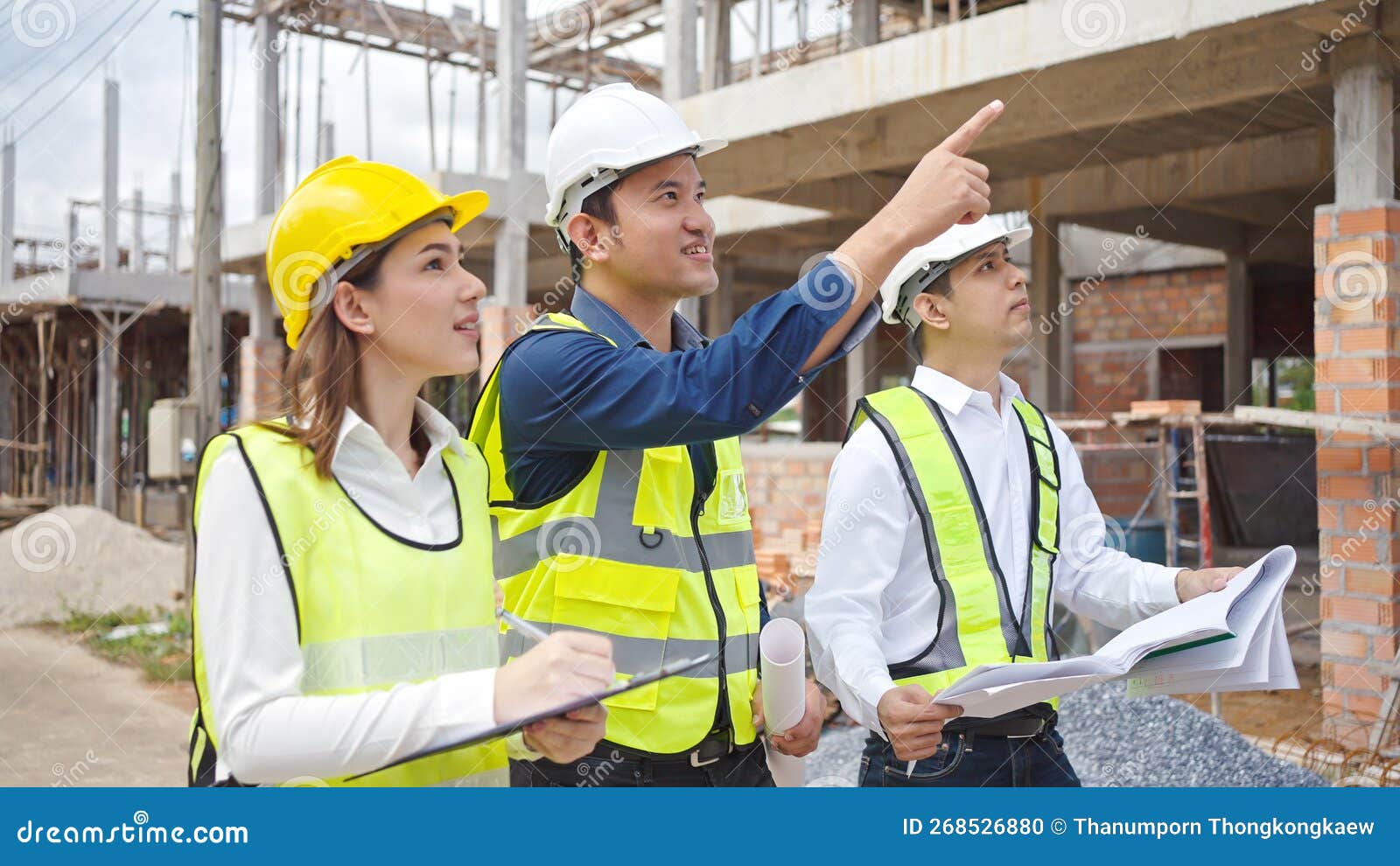 Asian Architector and Engineers Team with Draft Plan of Building ...