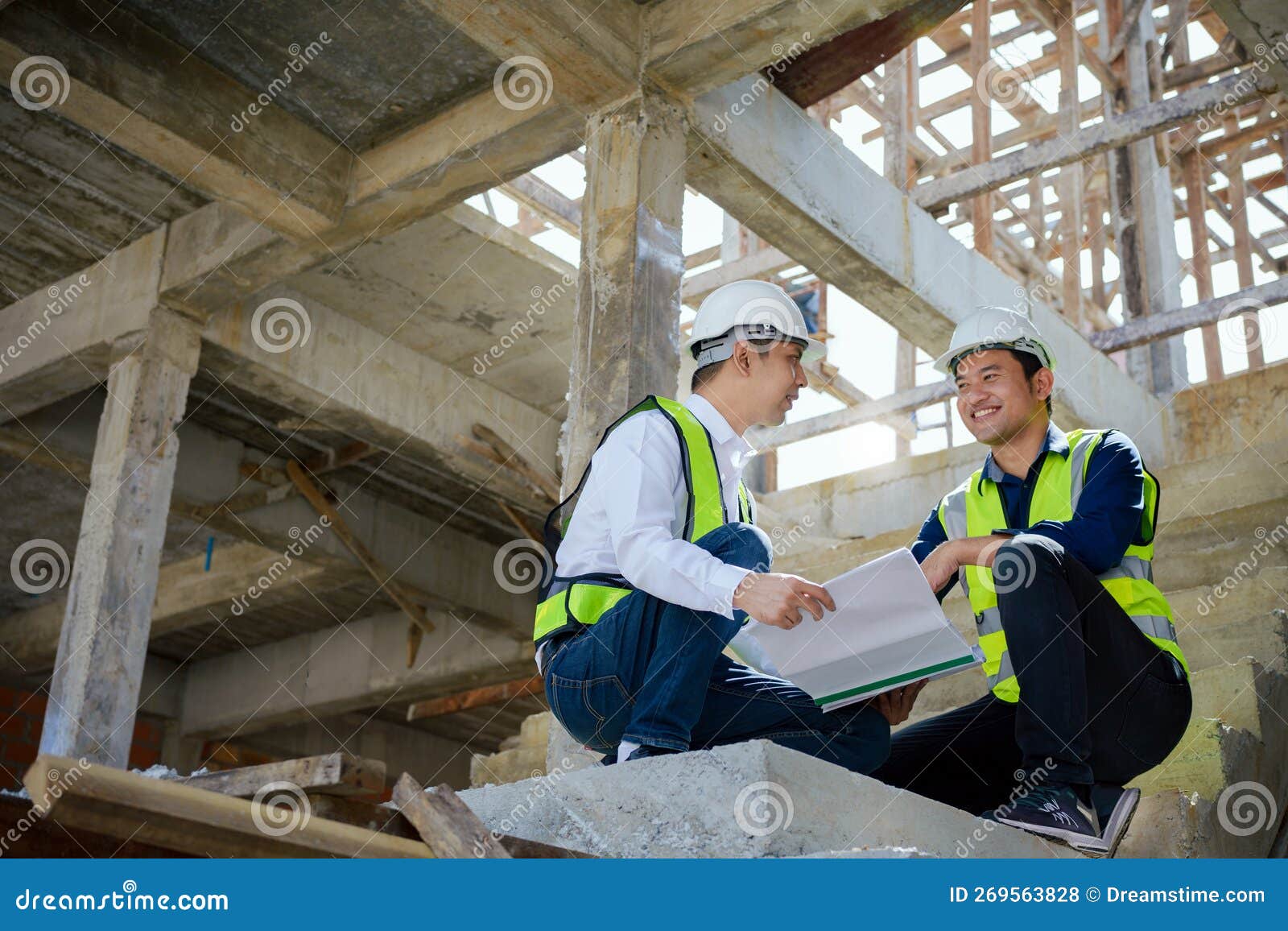 Asian Architector and Engineers Team with Draft Plan of Building and ...