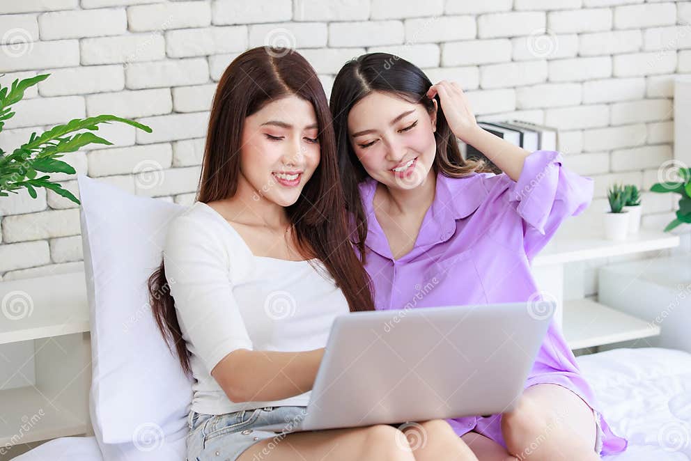 Asian Beautiful Cheerful Happy Female Lesbian Lover Couple Girlfriend In Casual Outfit Sitting