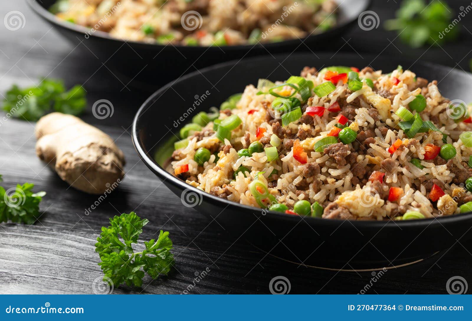 Asian Beef Fried Rice with Eggs and Vegetables in Black Bowl Stock ...