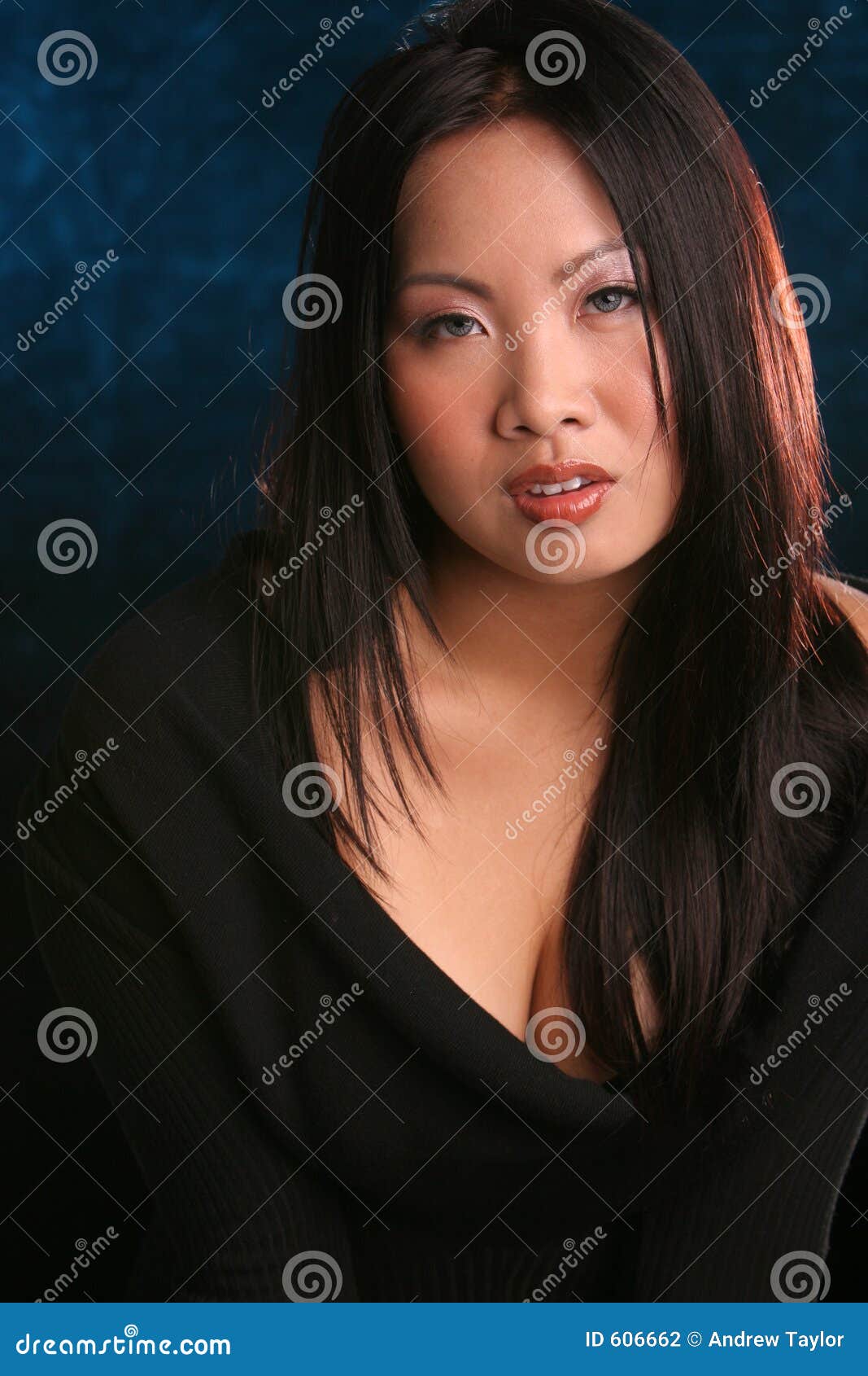 Asian on blue background stock photo. Image of brunette - 606662
