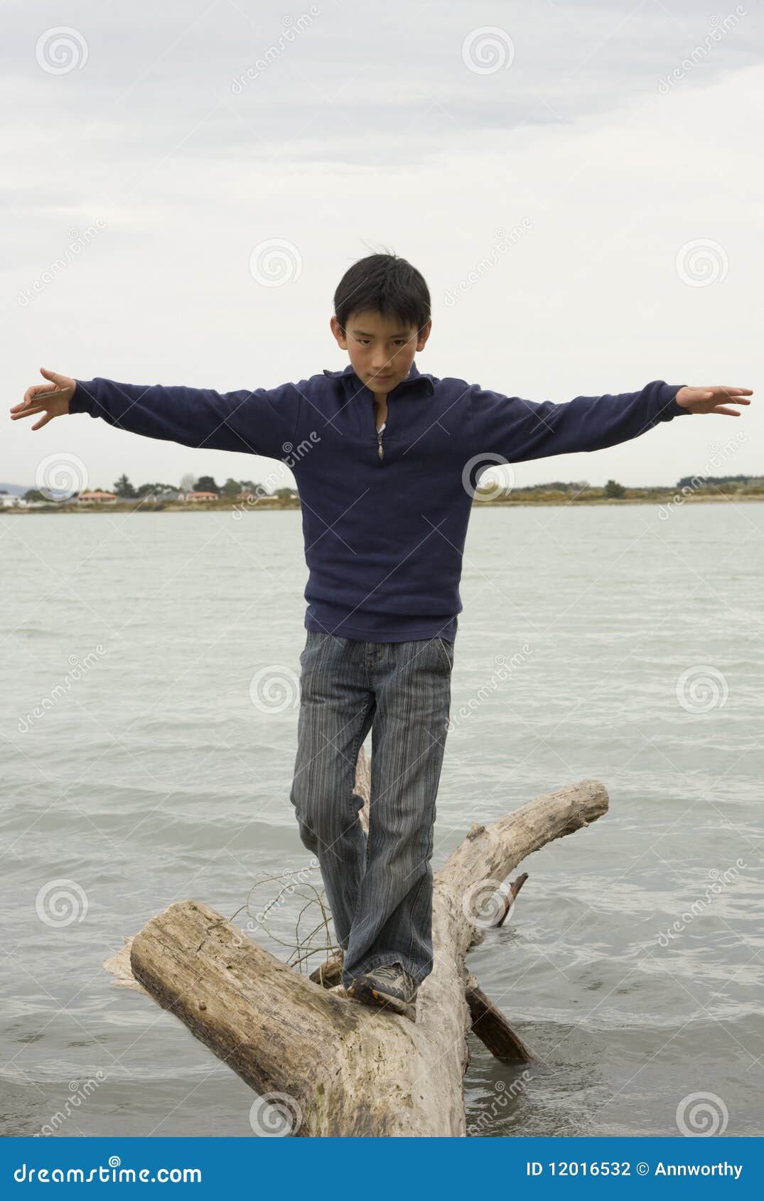 Asian Boy Balancing on Log Over Water Stock Photo - Image of asian ...