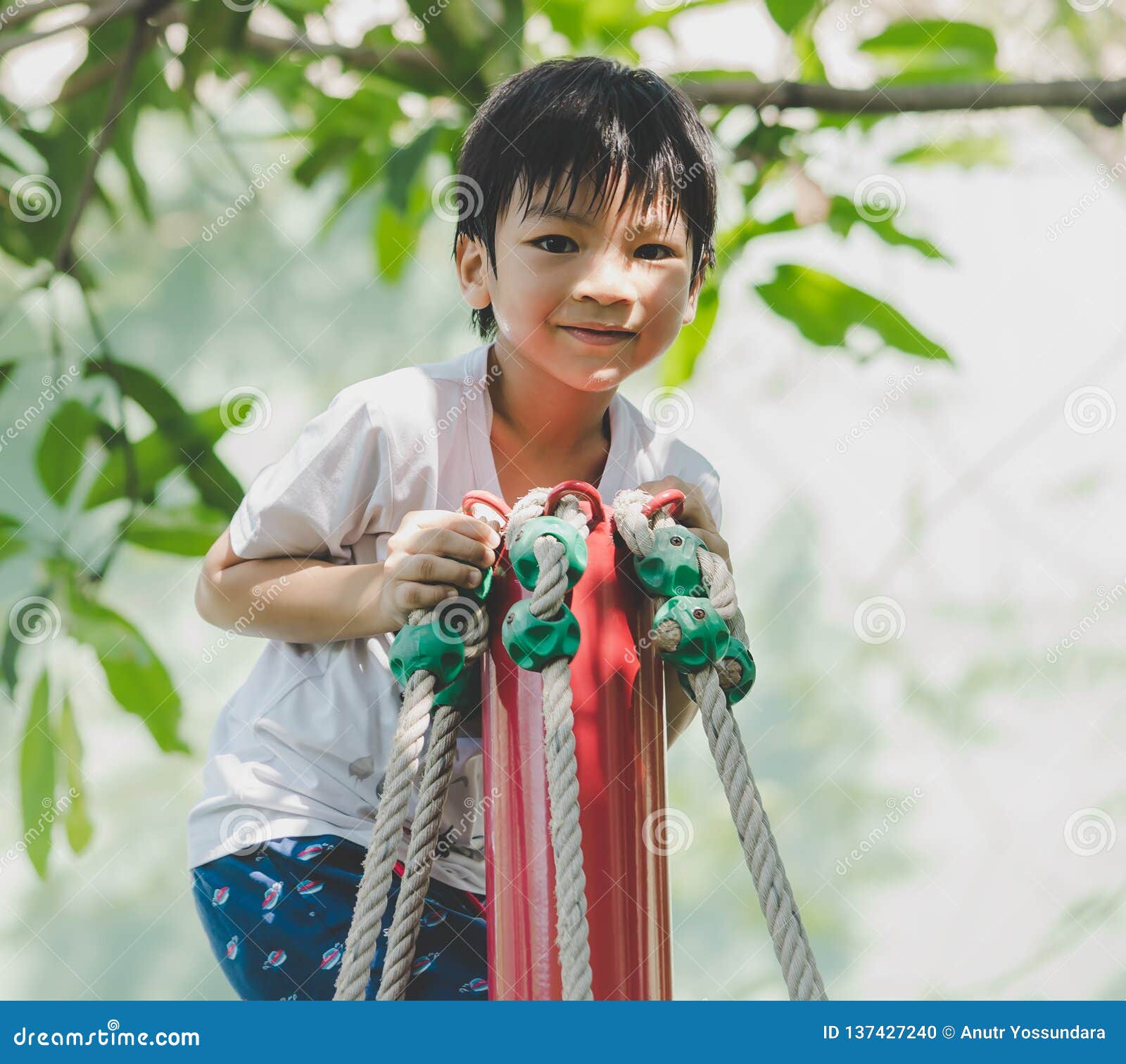 Asian Boy Climbing on Rope Pole in Playground Stock Photo - Image of ...