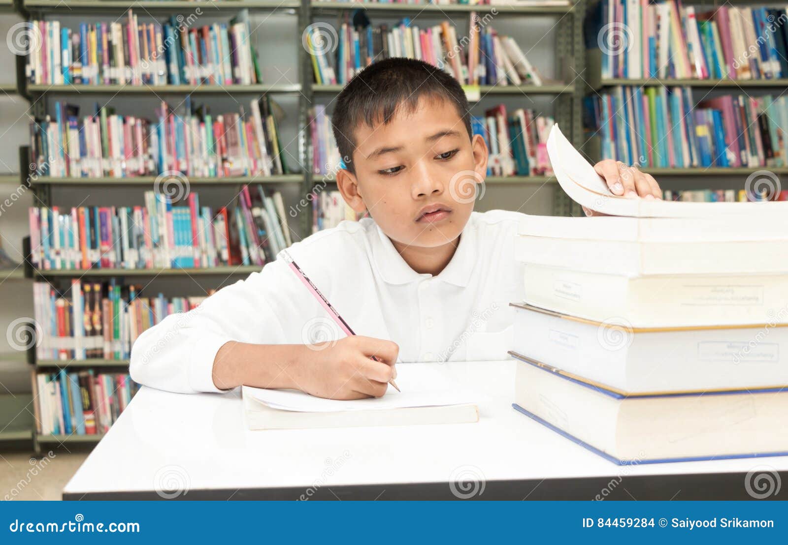Asian boy doing homework . stock photo. Image of class - 84459284
