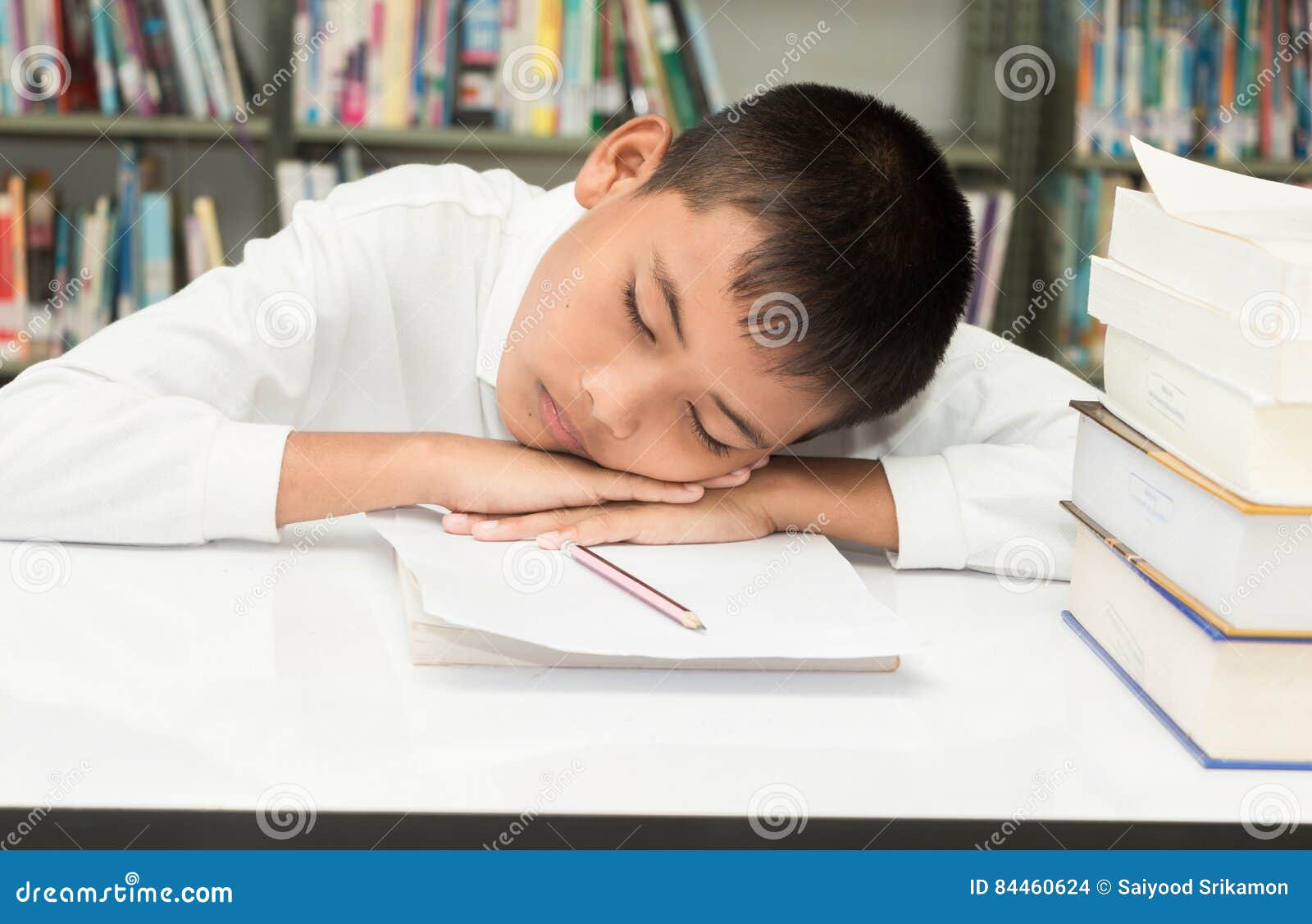 Asian boy doing homework . stock photo. Image of pencil - 84460624