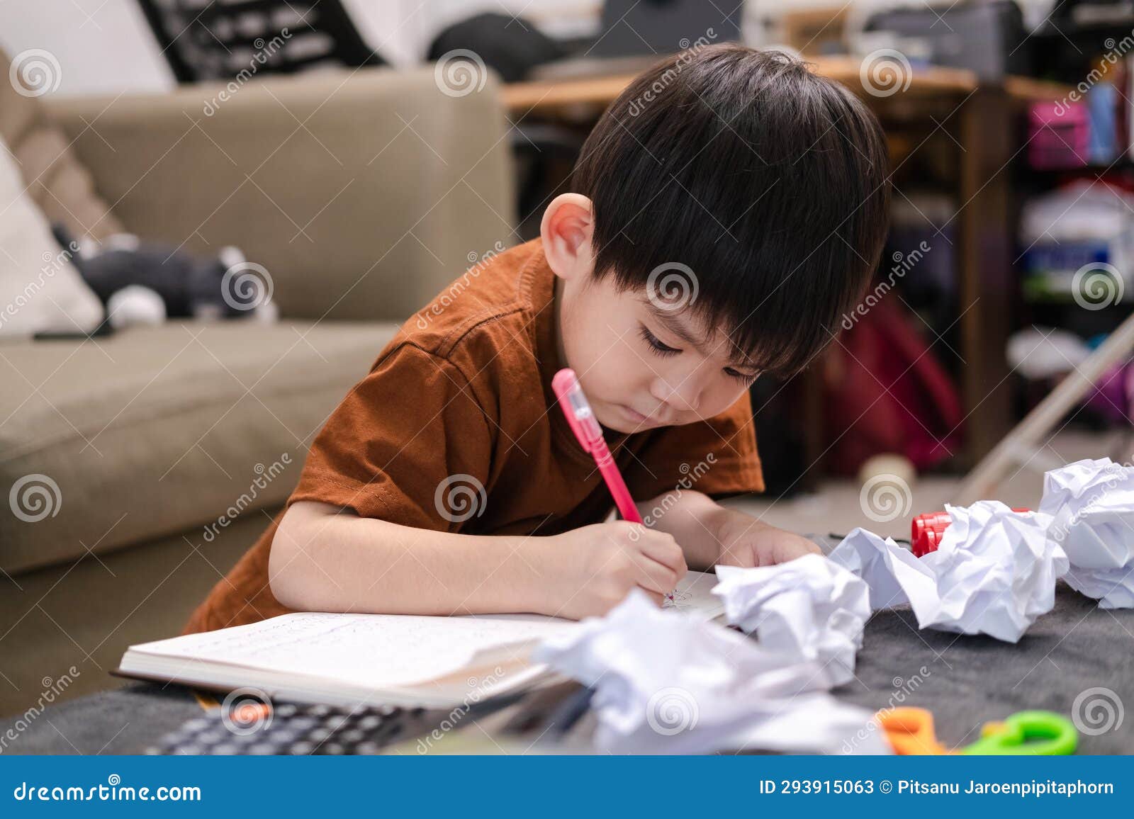 Asian Boy Drawing on Table and There Was a Piece of Paper Left on the ...