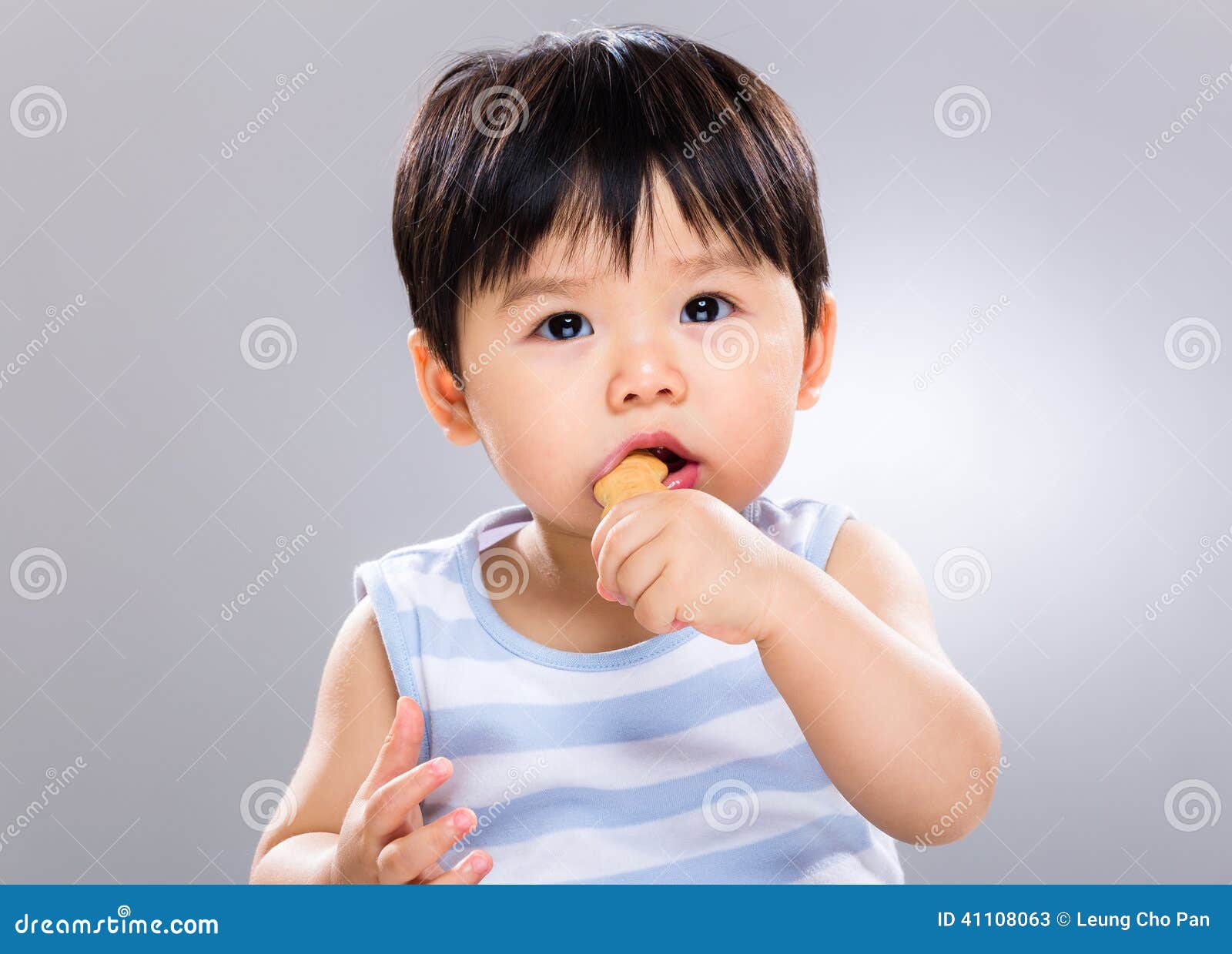 Asian boy eating snack stock image. Image of asian, childhood - 41108063