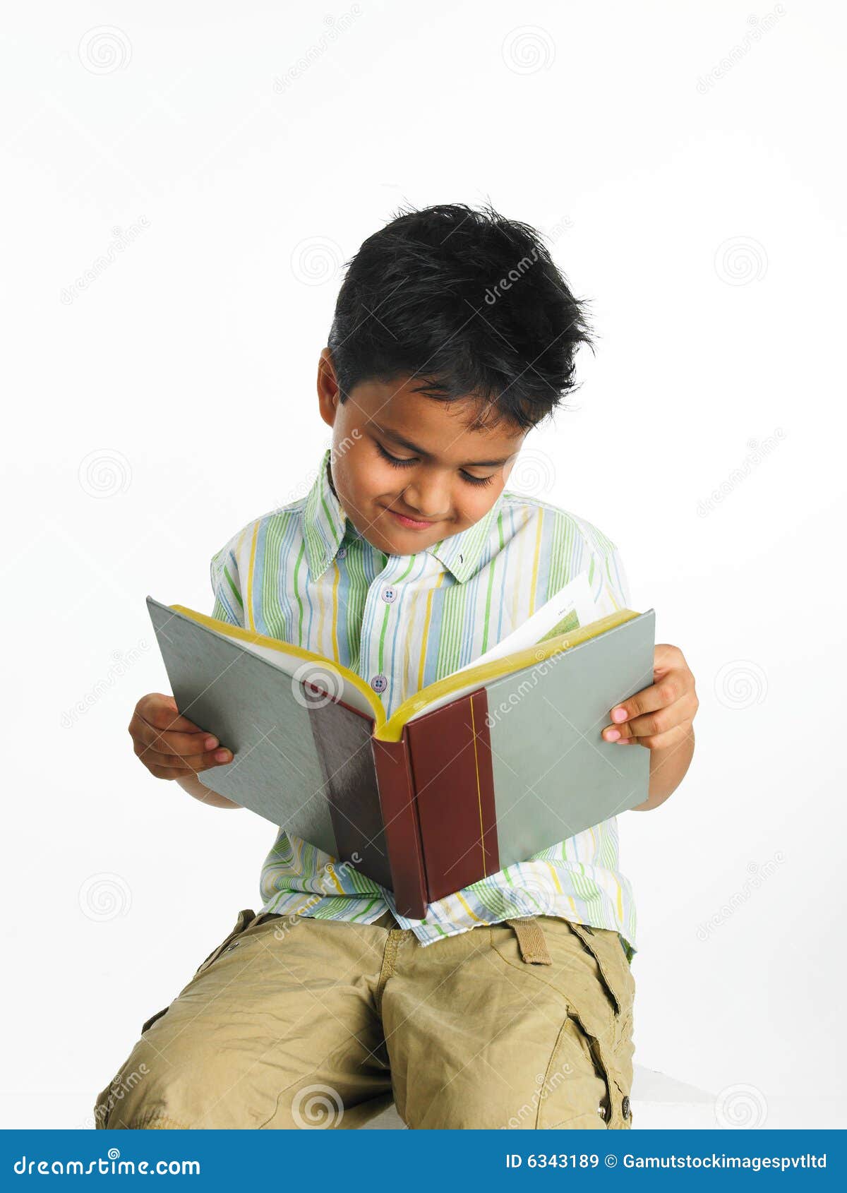 Asian Boy Engrossed in a Book Stock Image - Image of shirt, model: 6343189