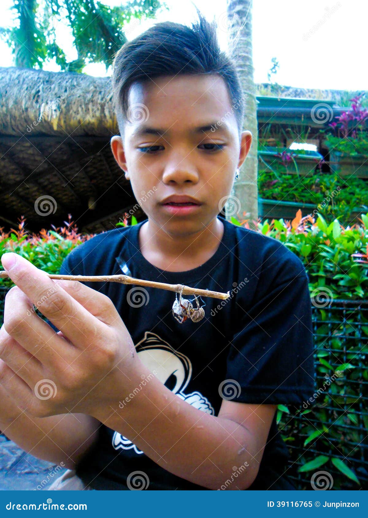Asian Boy Playing With Spiders Editorial Photo | CartoonDealer.com ...
