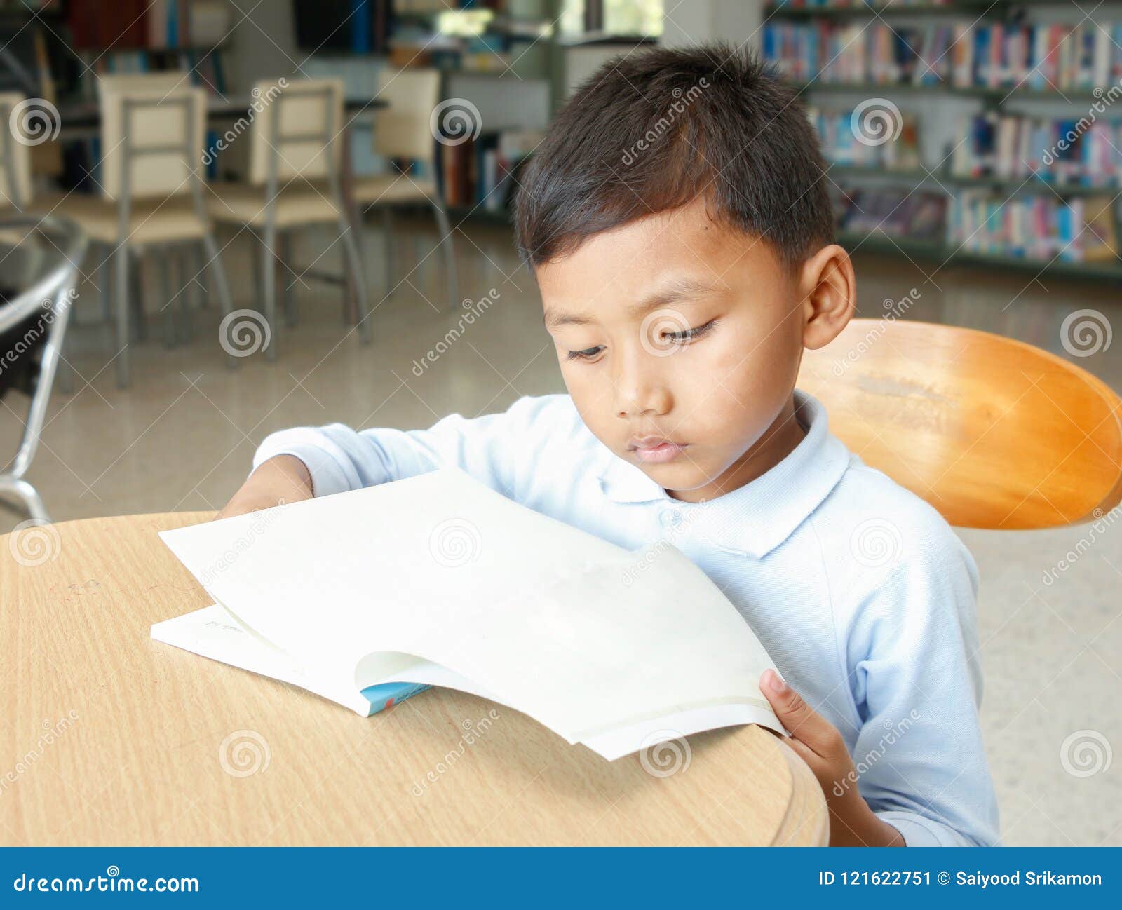 Asian boy doing homework . stock image. Image of classroom - 121622751