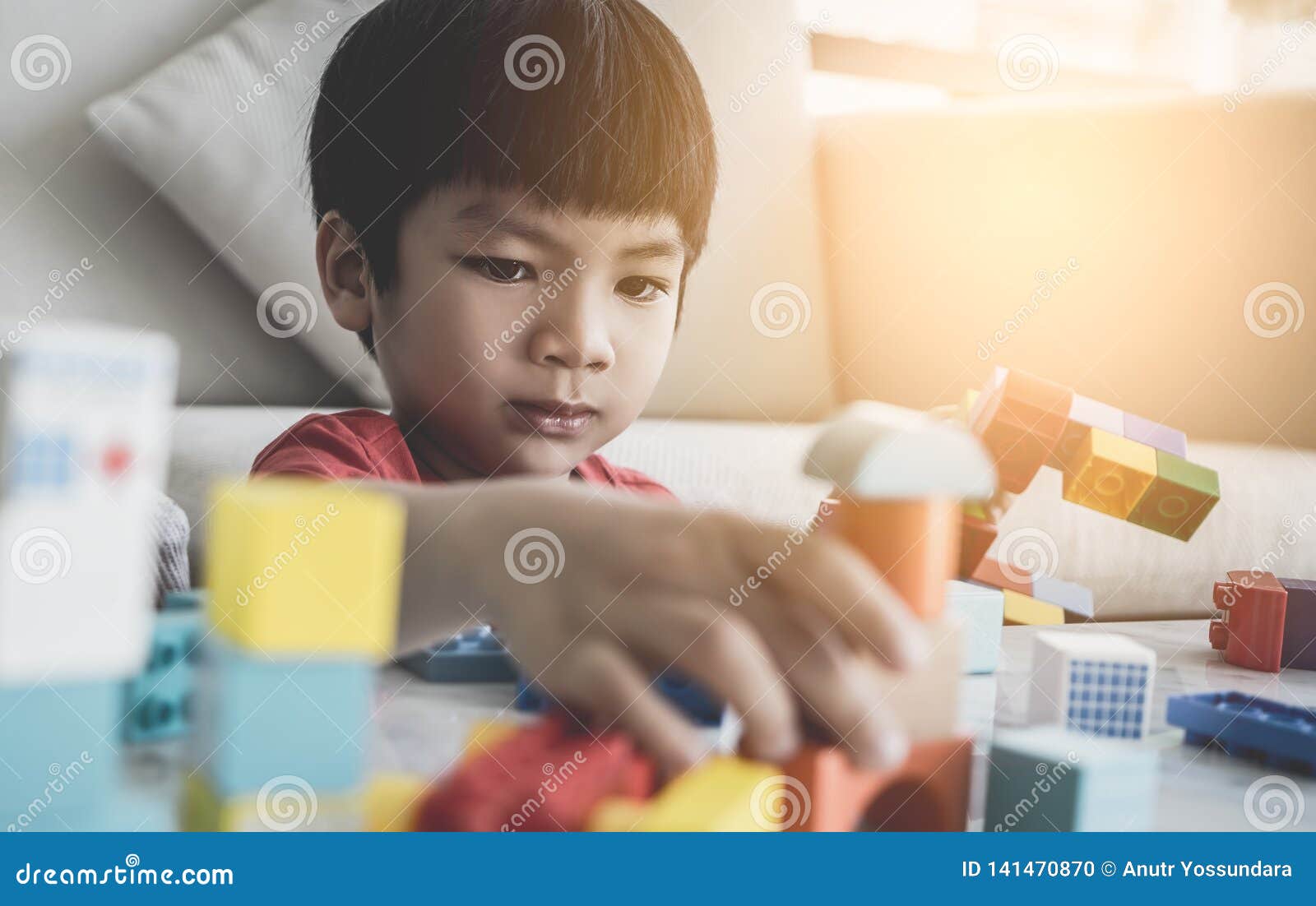 Boy Stacking Toy Blocks on a Living Room Table Stock Photo - Image of ...