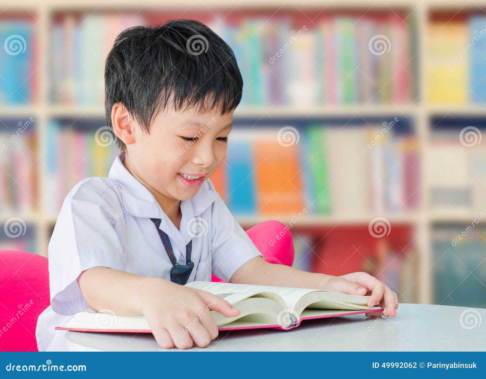 Asian Boy Student in School Library Stock Photo - Image of book, seven ...