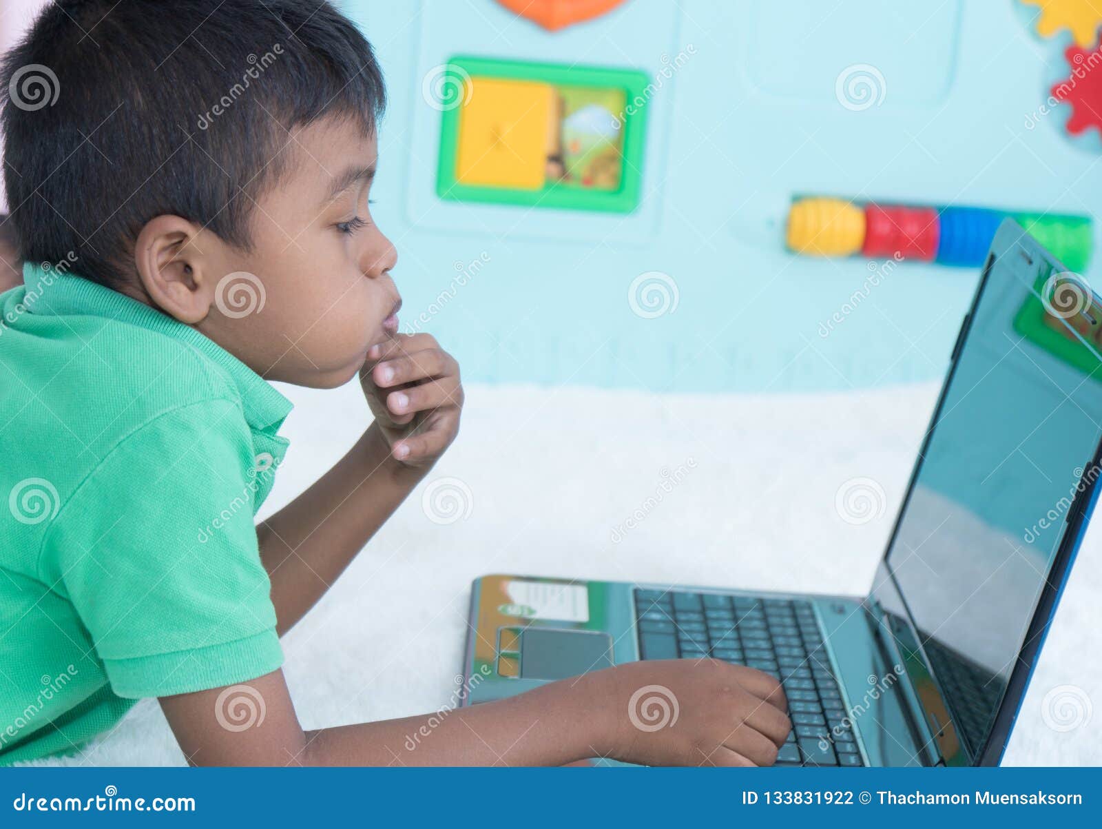 Asian boy useing computer stock photo. Image of learning - 133831922