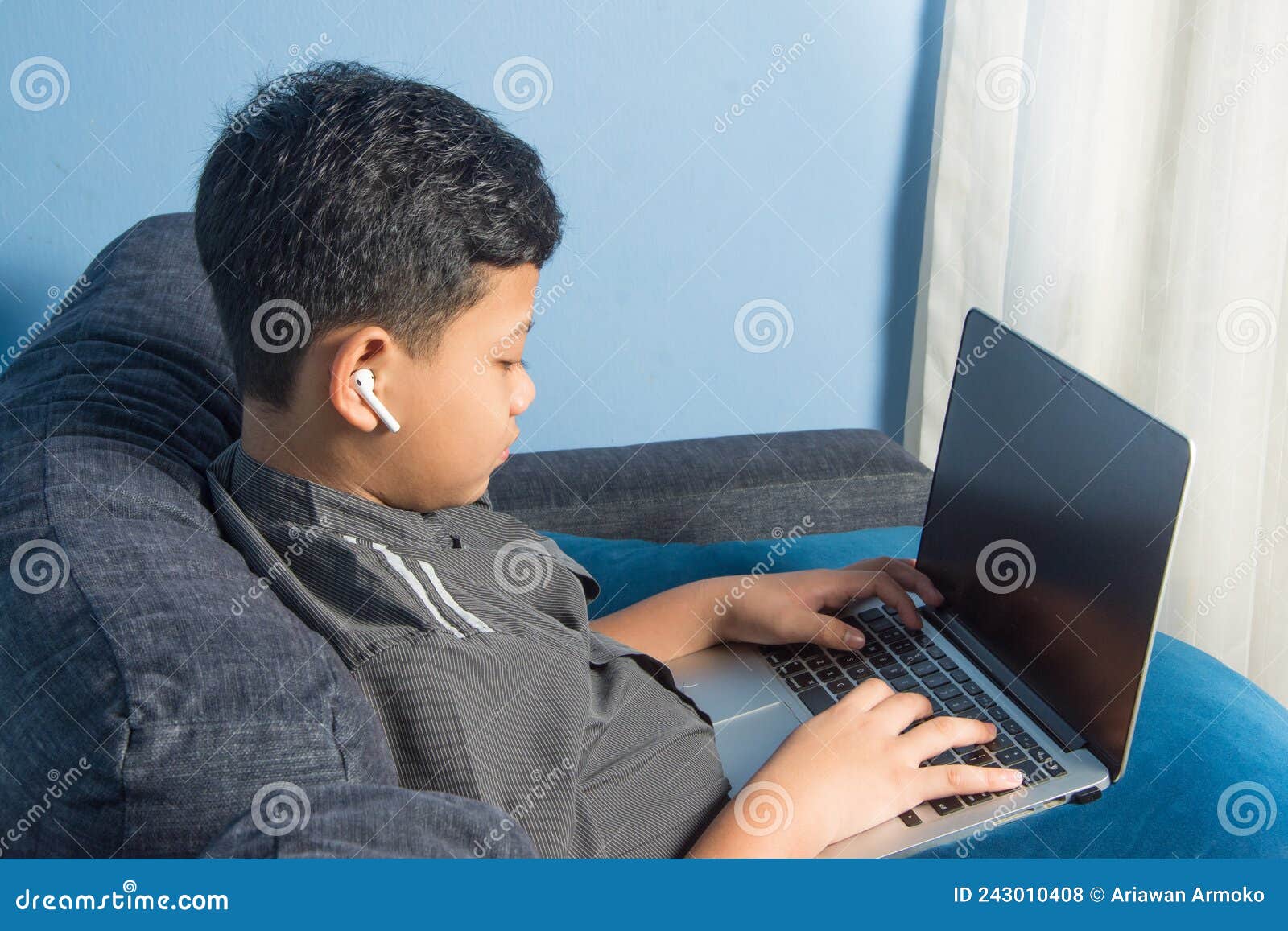 Asian Boy Using Laptop Computer, Side View Stock Photo - Image of ...