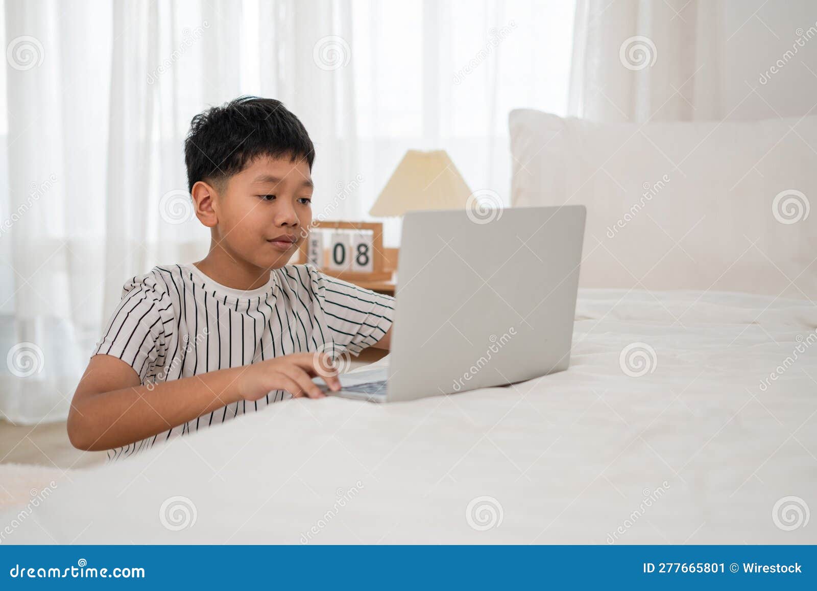 Asian Boy Using the Laptop To Do Homework at Home. Stock Image - Image ...