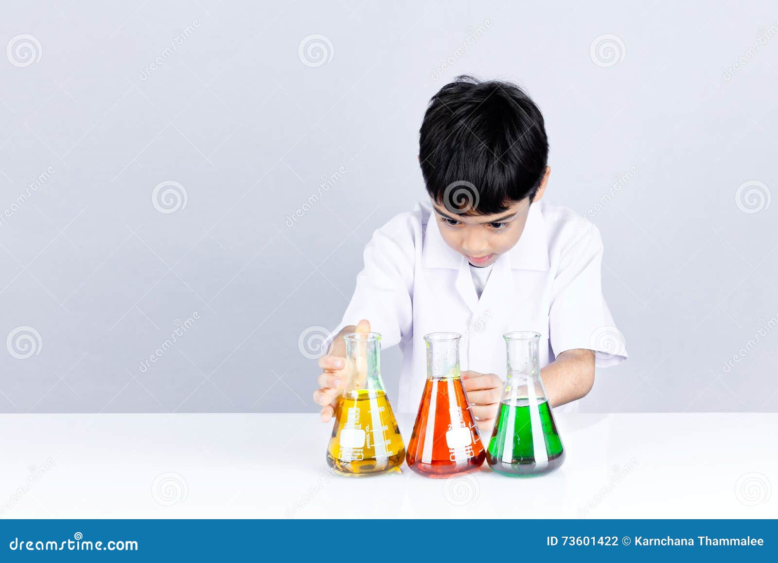 Asian Boy is Viewing Test Color Combination on Science Experiment ...