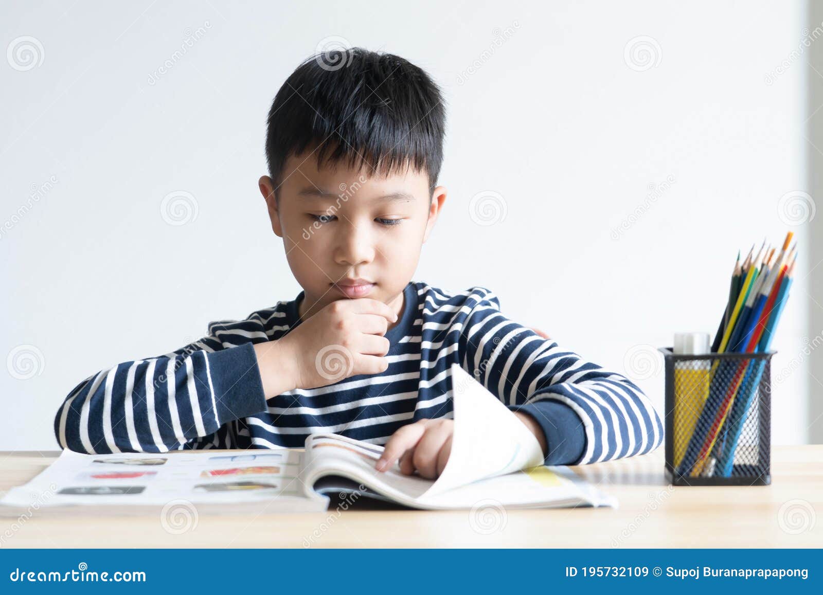 Asian Boy Who are Studying in Elementary School Reading and Doing ...