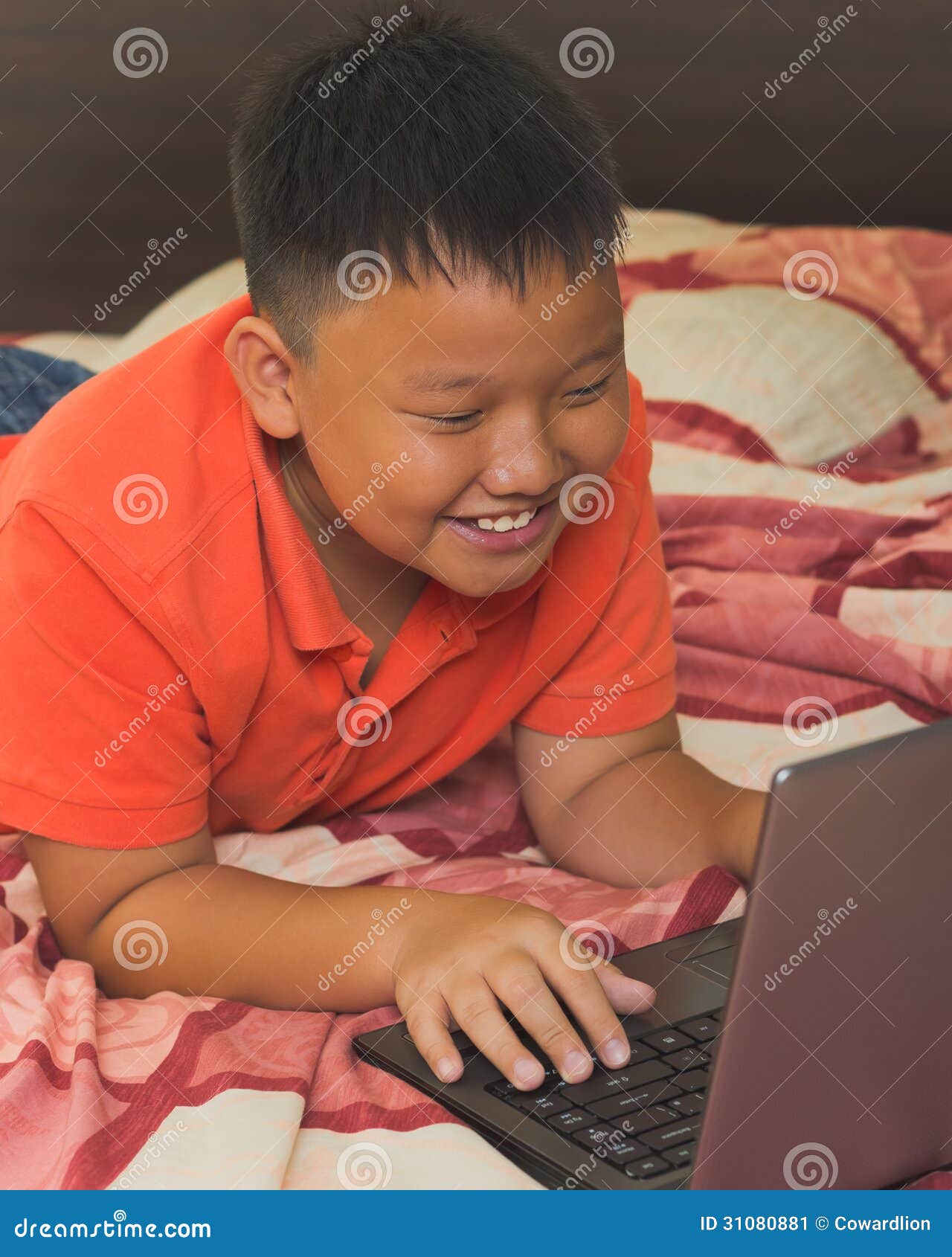 Asian Boy Working on a Laptop Computer Stock Image - Image of bedroom ...