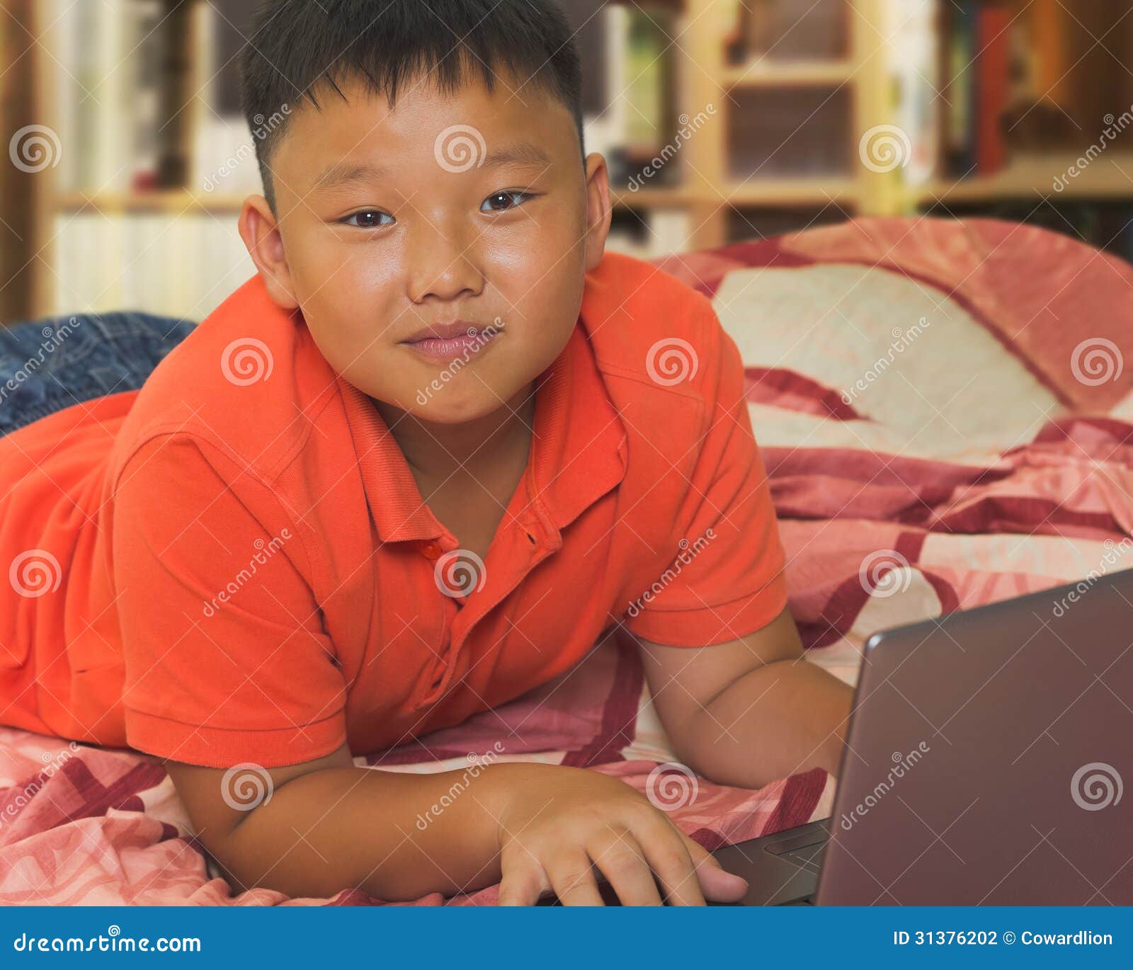 Asian Boy Working on a Laptop Computer Stock Photo - Image of cheerful ...