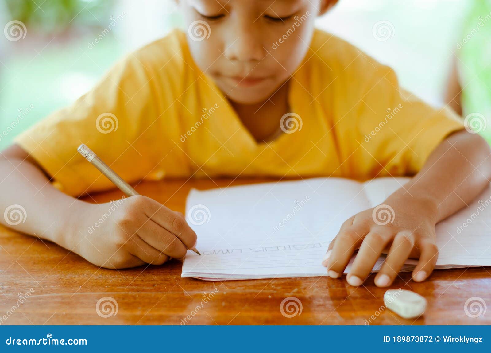 Asian Child Concentrate To Write the Alphabet. Stock Photo - Image of ...