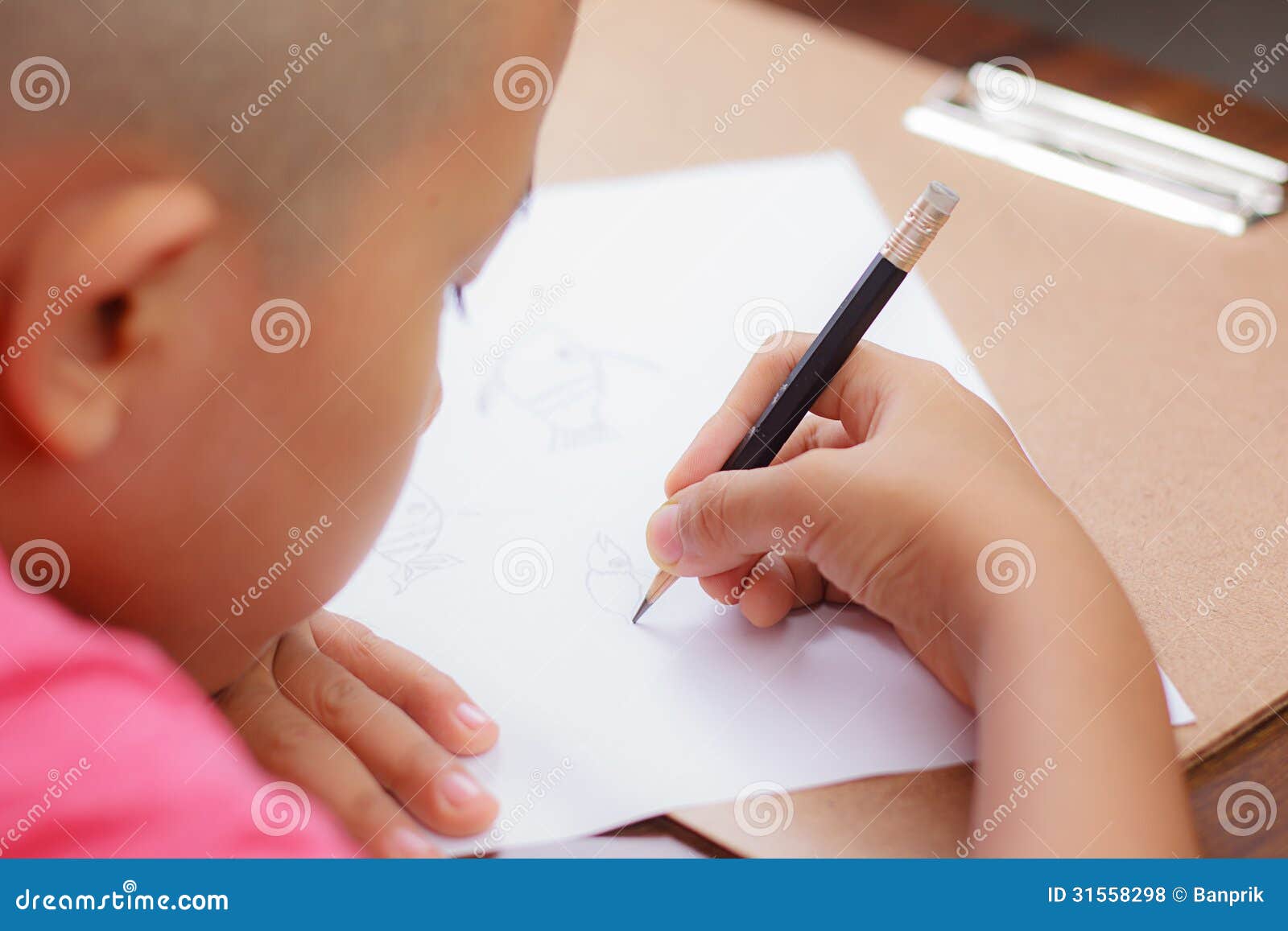An Asian Boy is Writing on White Paper Stock Photo - Image of student ...