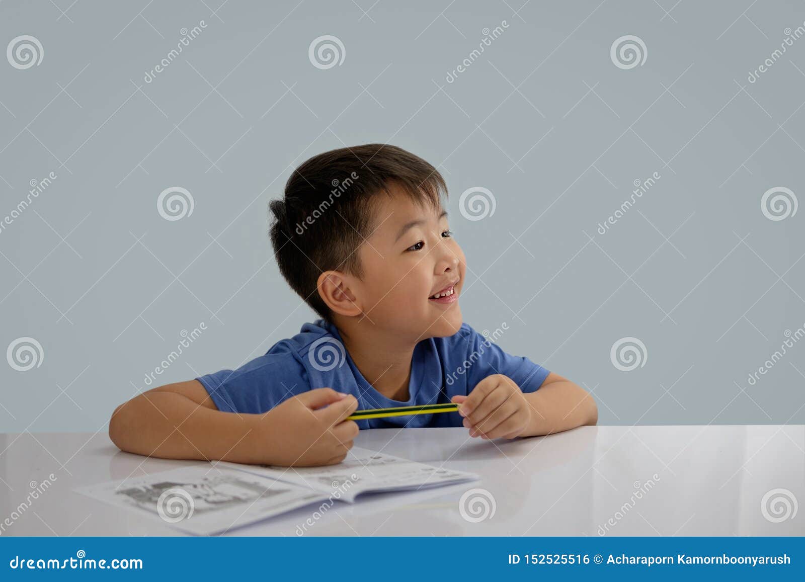 Asian Boys are Doing Some Writing on the Book Stock Photo - Image of ...