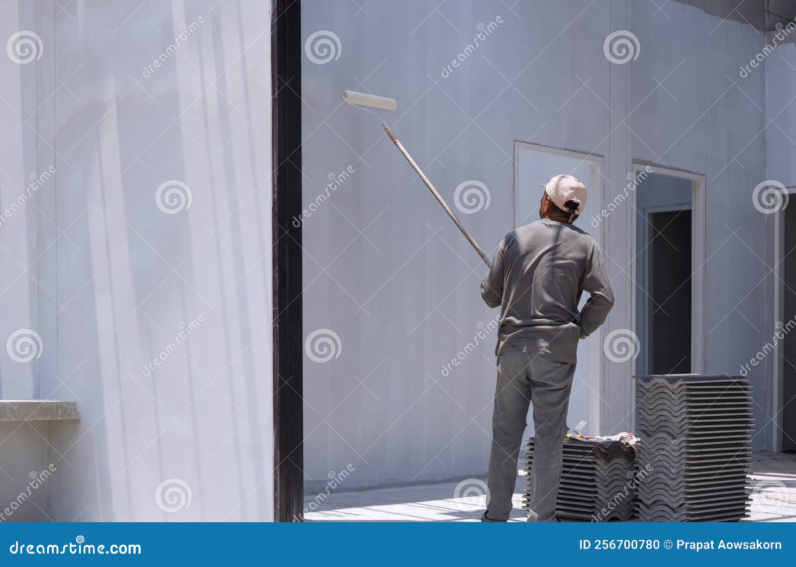 Asian Builder Worker Applying Primer White Paint on Concrete Wall in ...