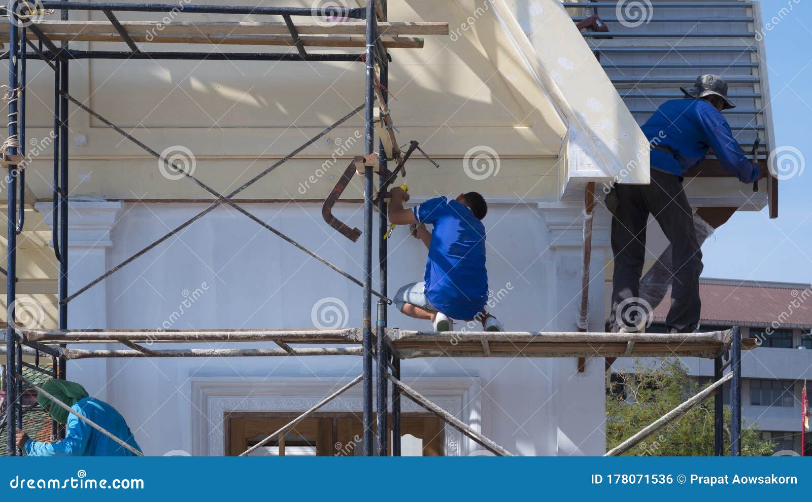 Asian Builder Workers with Work Tools on Scaffolding are Working To ...