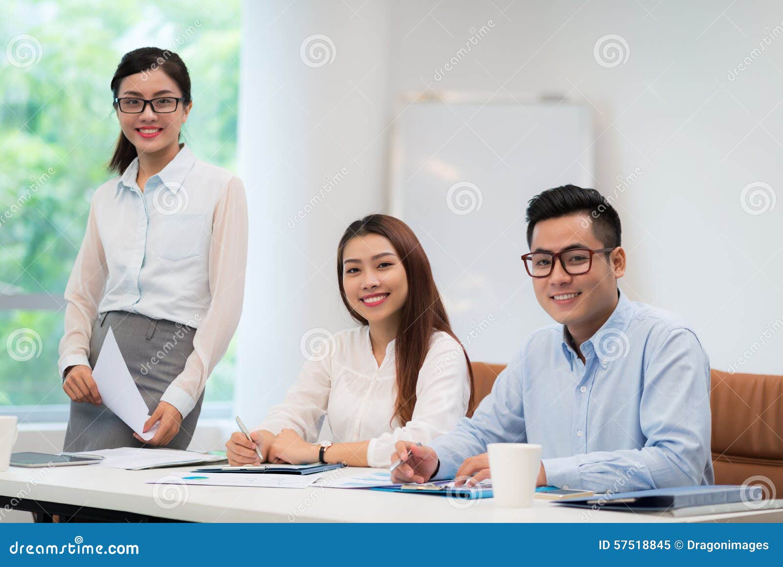 Asian business colleagues stock image. Image of documents - 57518845