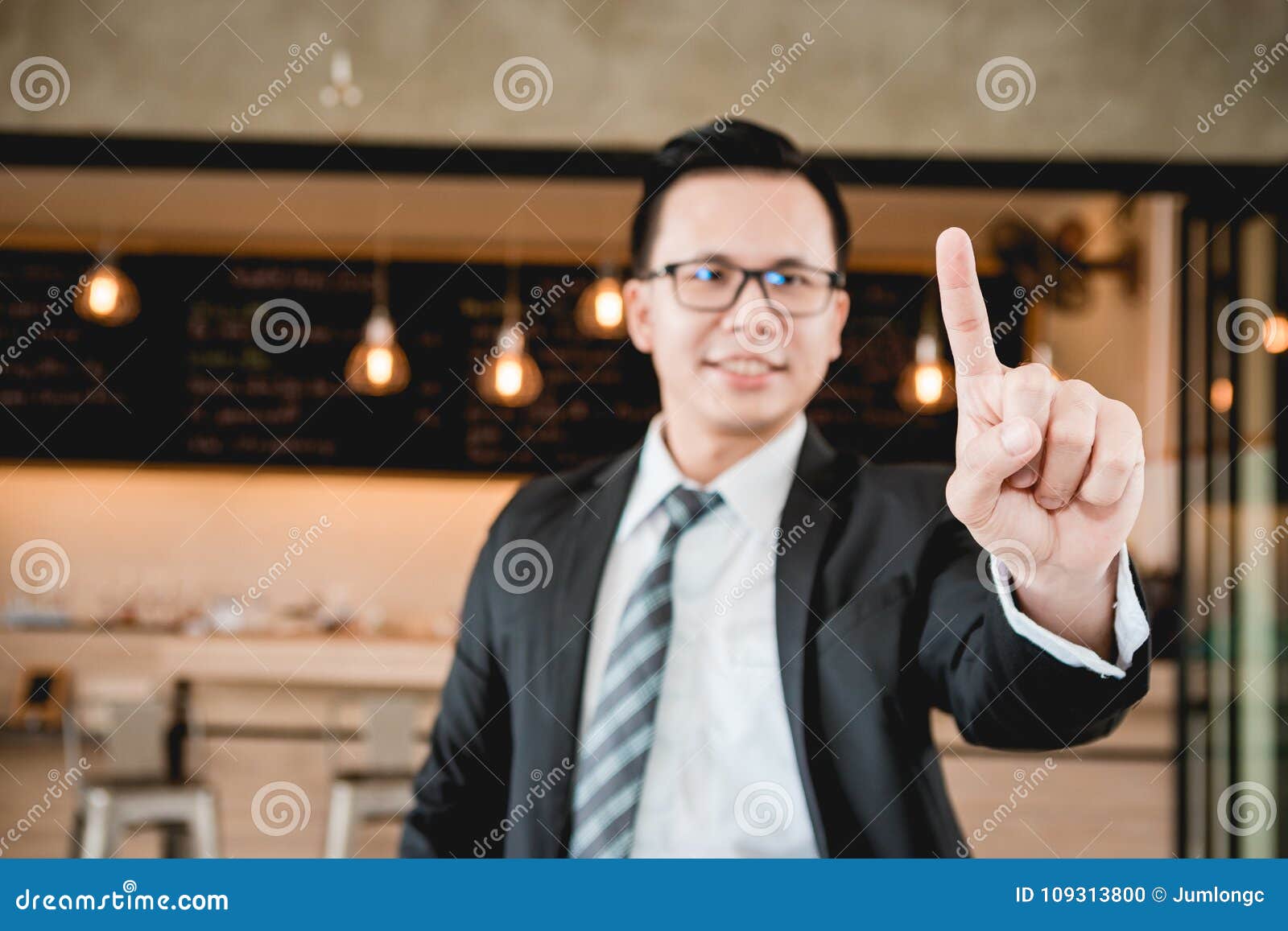 An Asian Business Man is Pointing with Left Hand. Stock Photo - Image ...