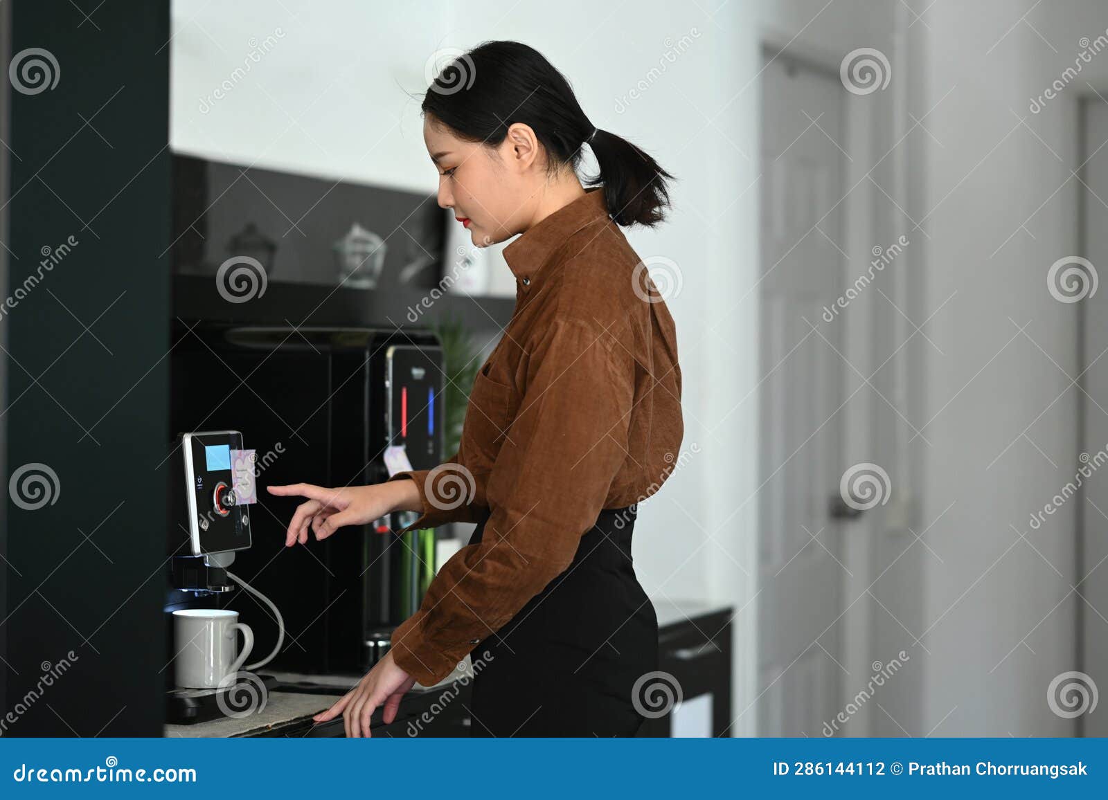 Asian Business Woman Using Coffee Machine in the Office. Stock Photo ...