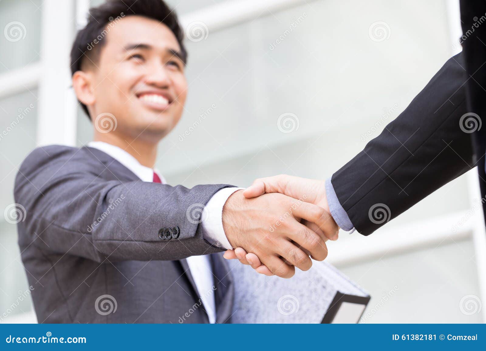Asian Businessman Making Handshake with Smiling Face Stock Image ...