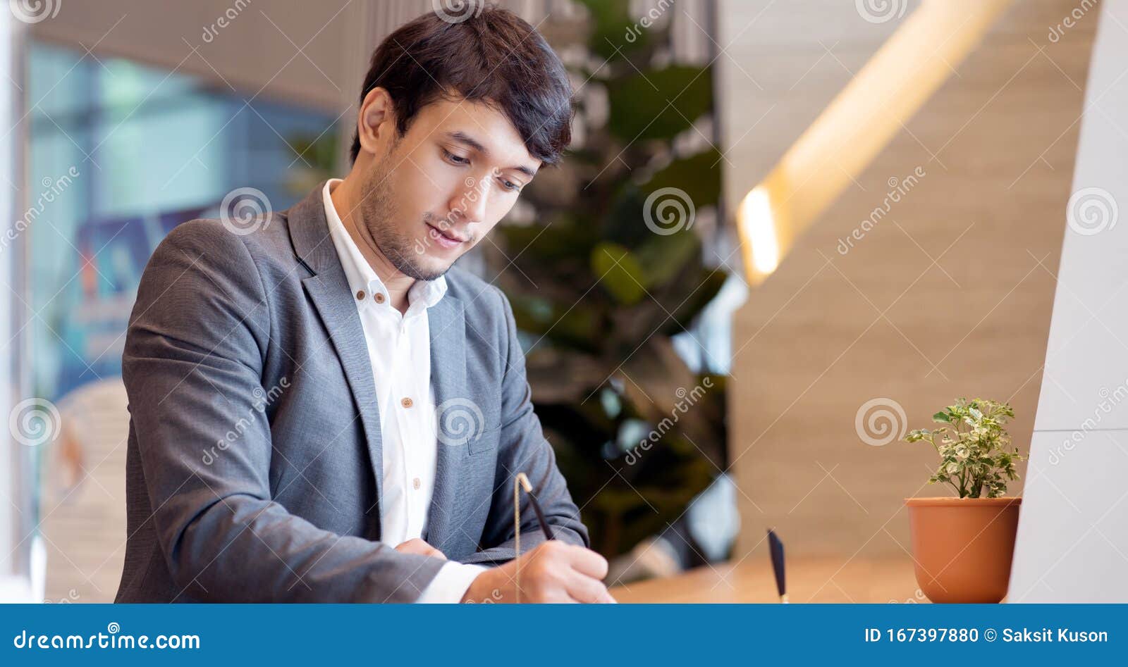 Asian Businessman Sign or Write Document in Modern Office. Stock Photo ...