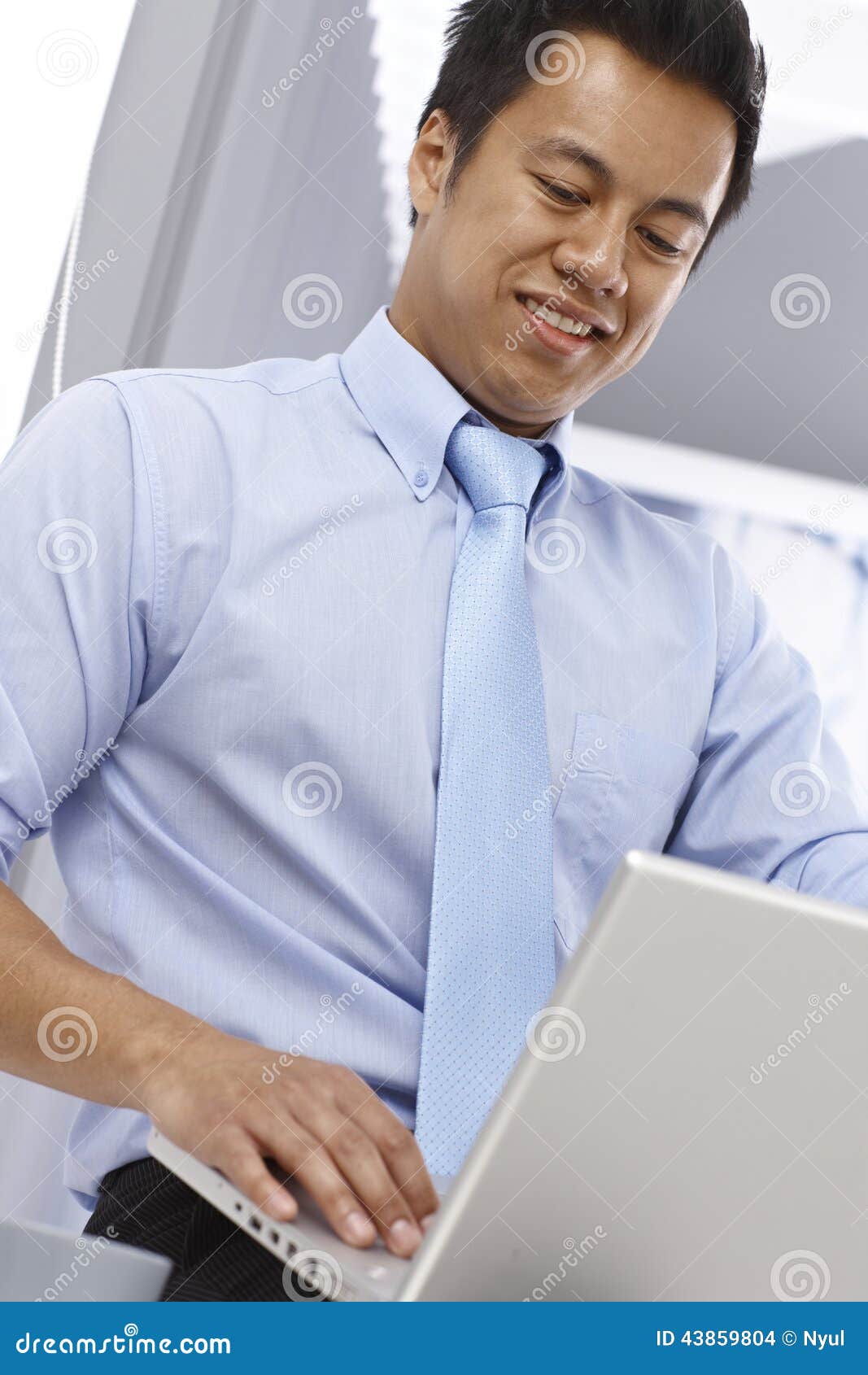 Asian Businessman Using Laptop Stock Photo - Image of seated, oriental ...