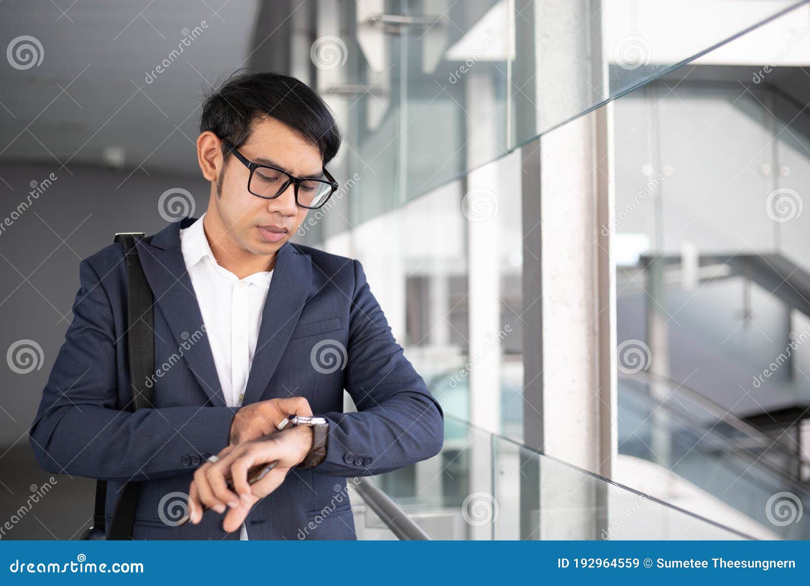 Asian Businessman Watching Time and Going To Work in the Morning Stock ...