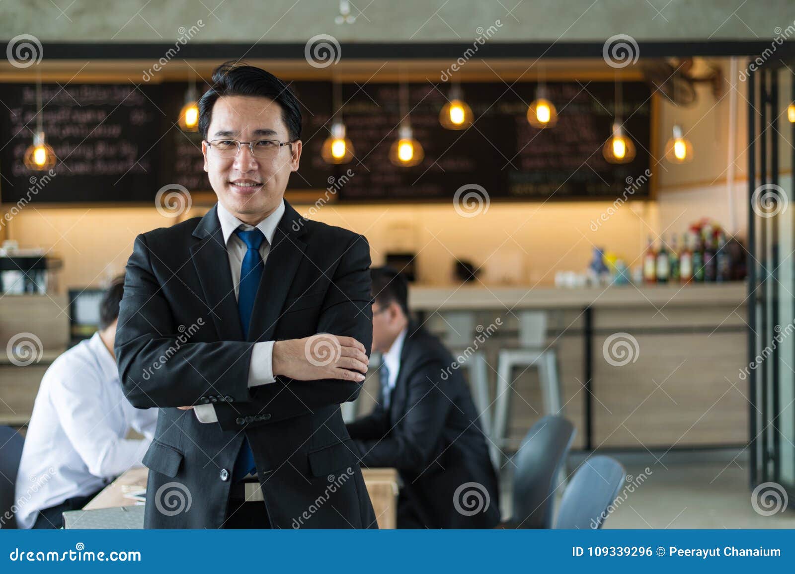 Asian Businessman Standing, Smiling and Looking To Camera. Business ... Asian Businessman Standing, Smiling and Looking To Camera. Business ...