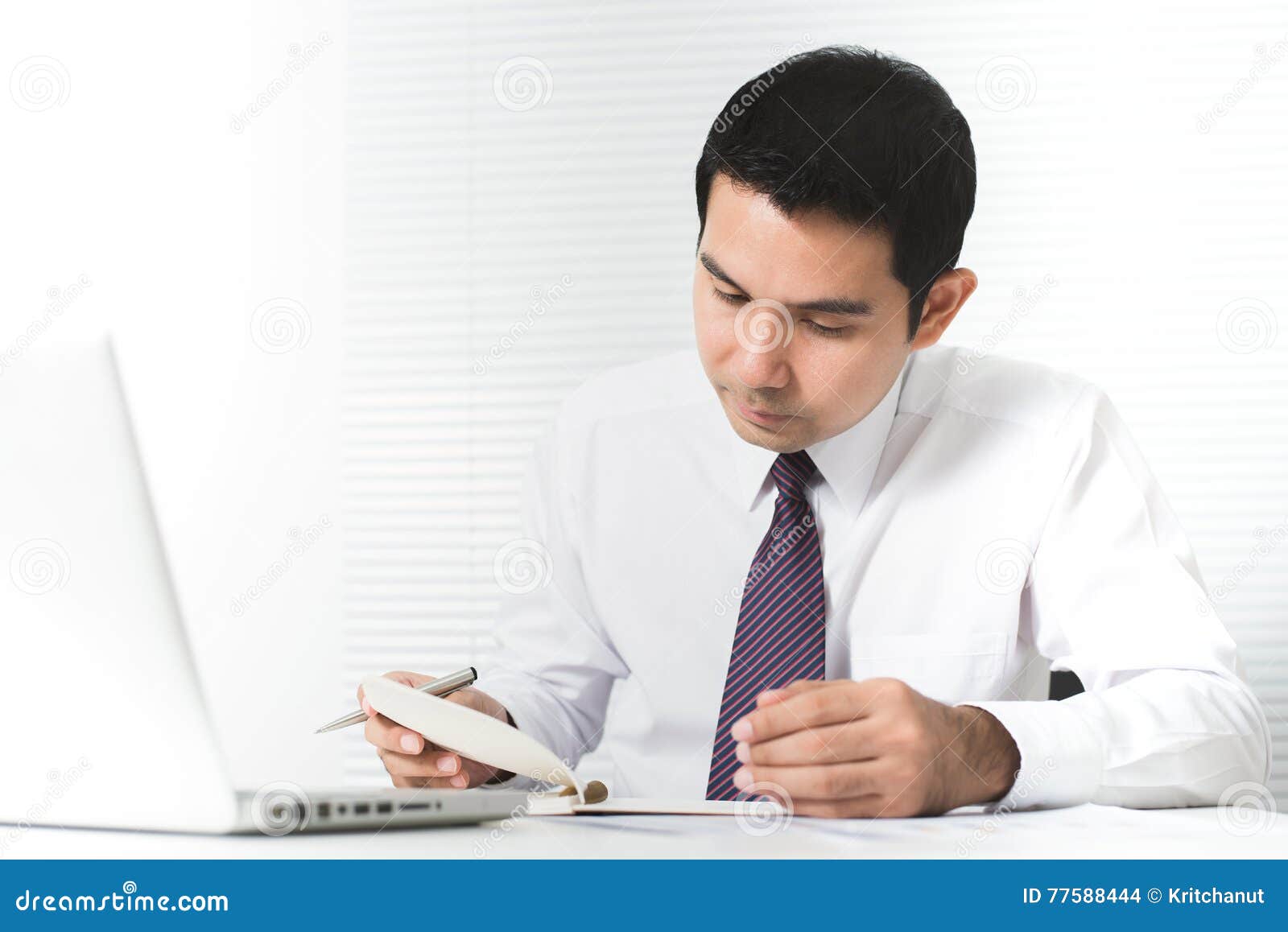 Asian Businessman Working Seriously in the Office with Laptop Co Stock ...