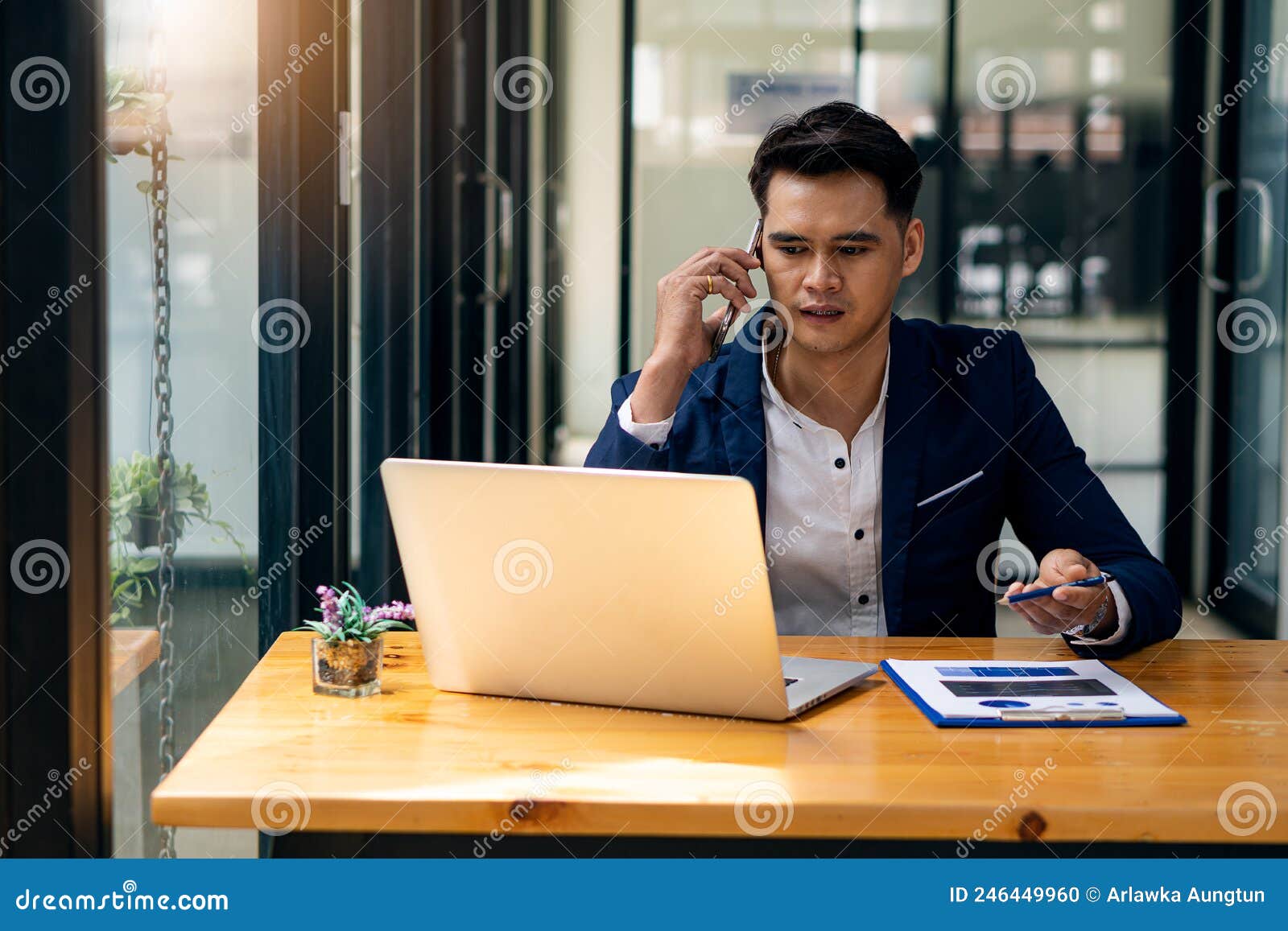 Asian Businessmen Using Smartphone To Talk Business Using Laptop ...