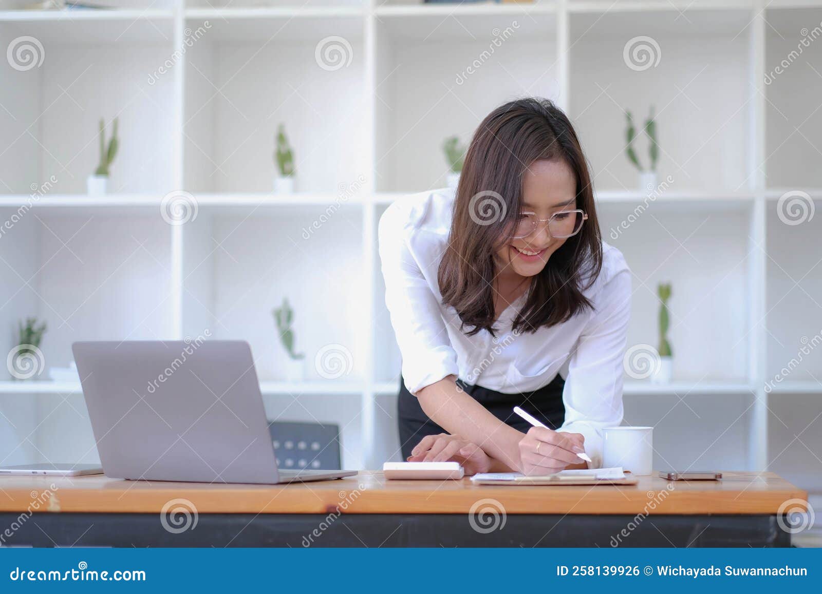 Asian Businesswoman Using Laptop Computer and Working at Office with ...