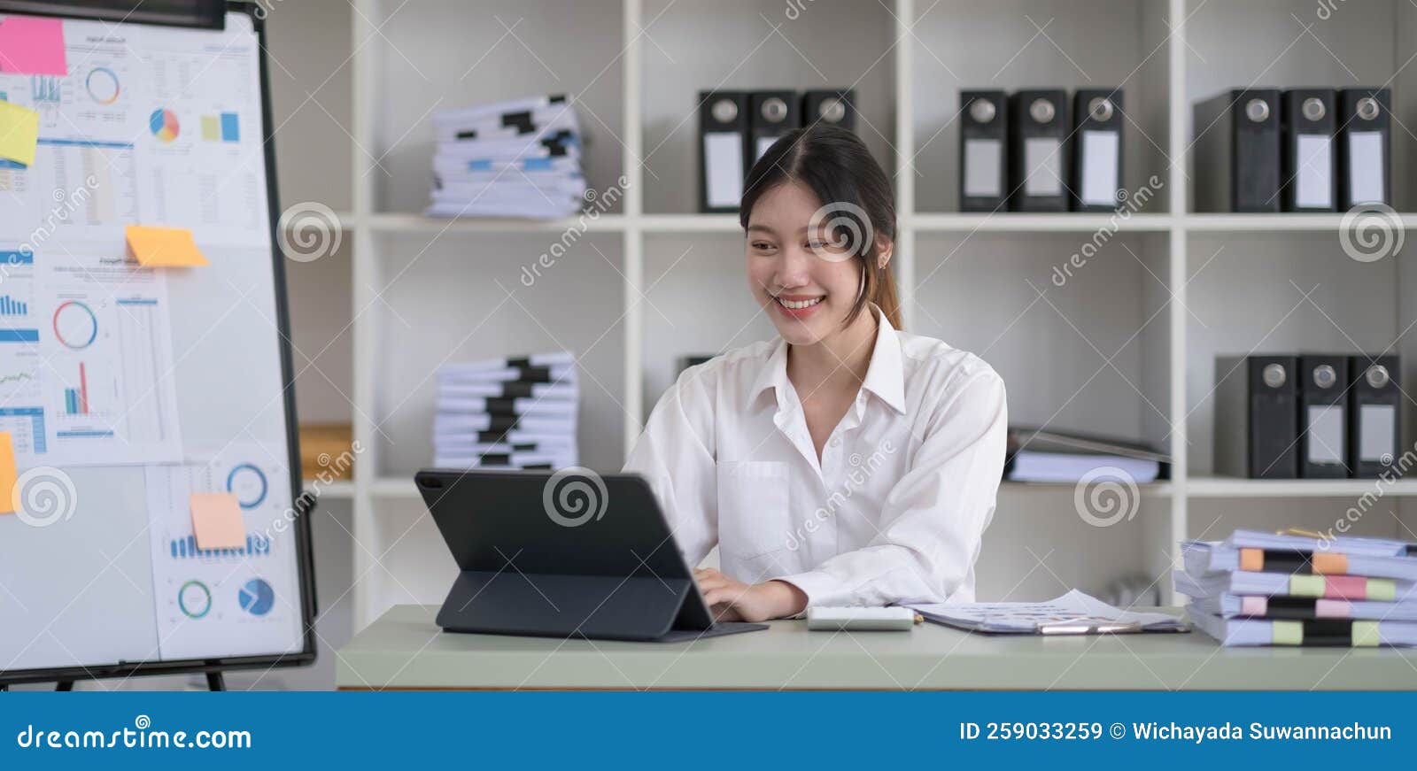 Asian Businesswoman Using Laptop Computer and Working at Office with ...