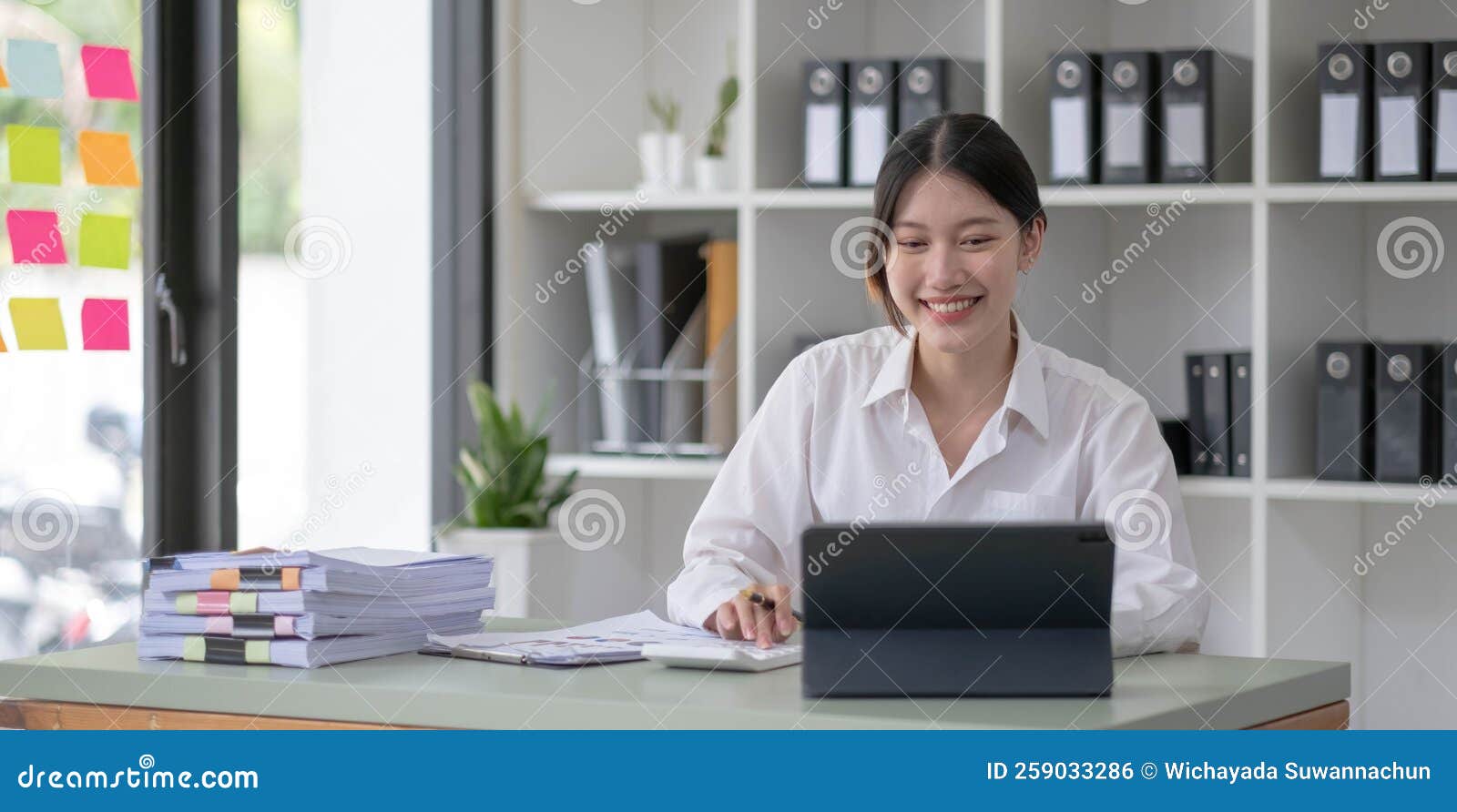 Asian Businesswoman Using Laptop Computer and Working at Office with ...