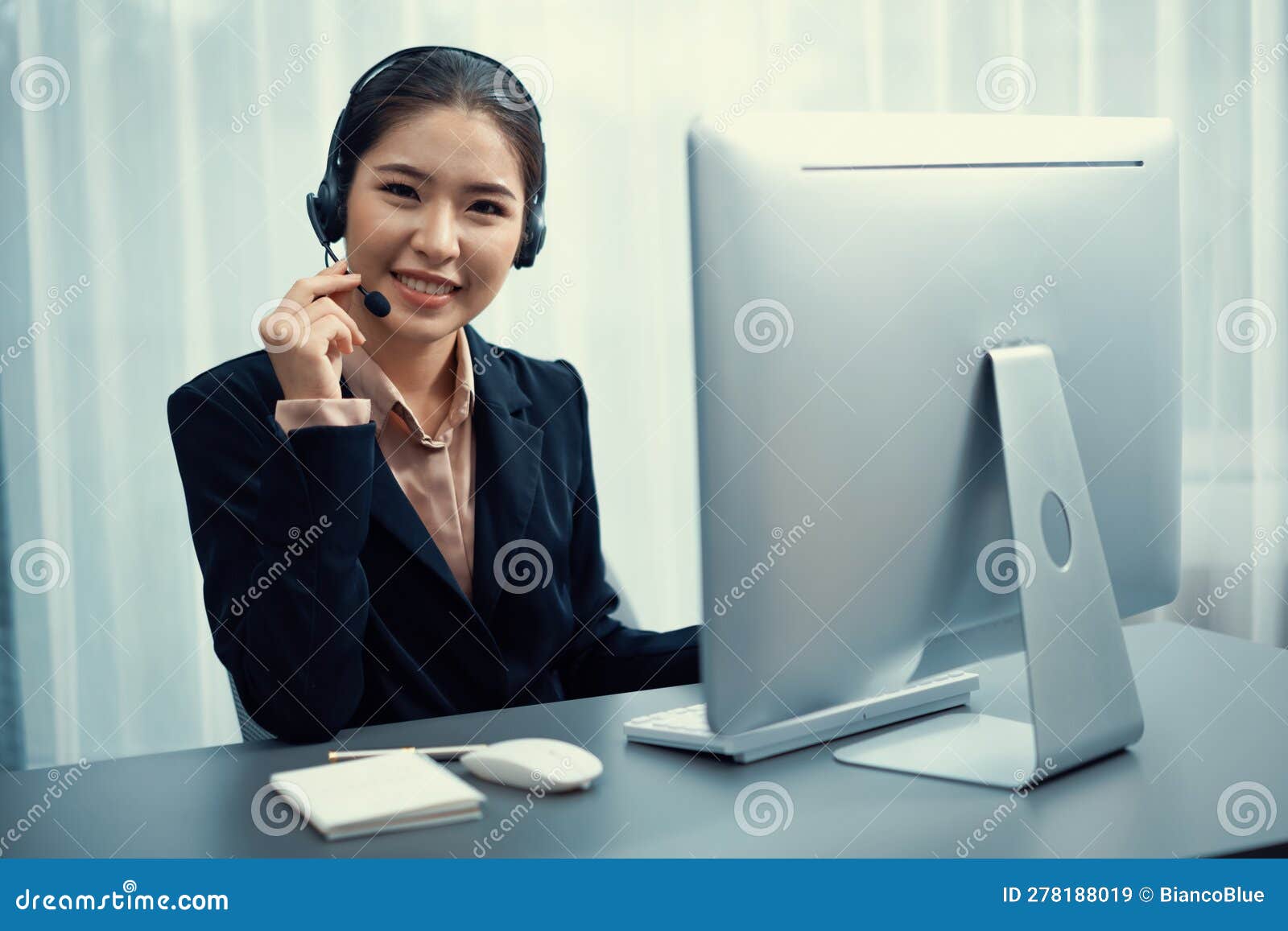 Enthusiastic Asian Call Center with Headset on Her Workplace Portrait ...