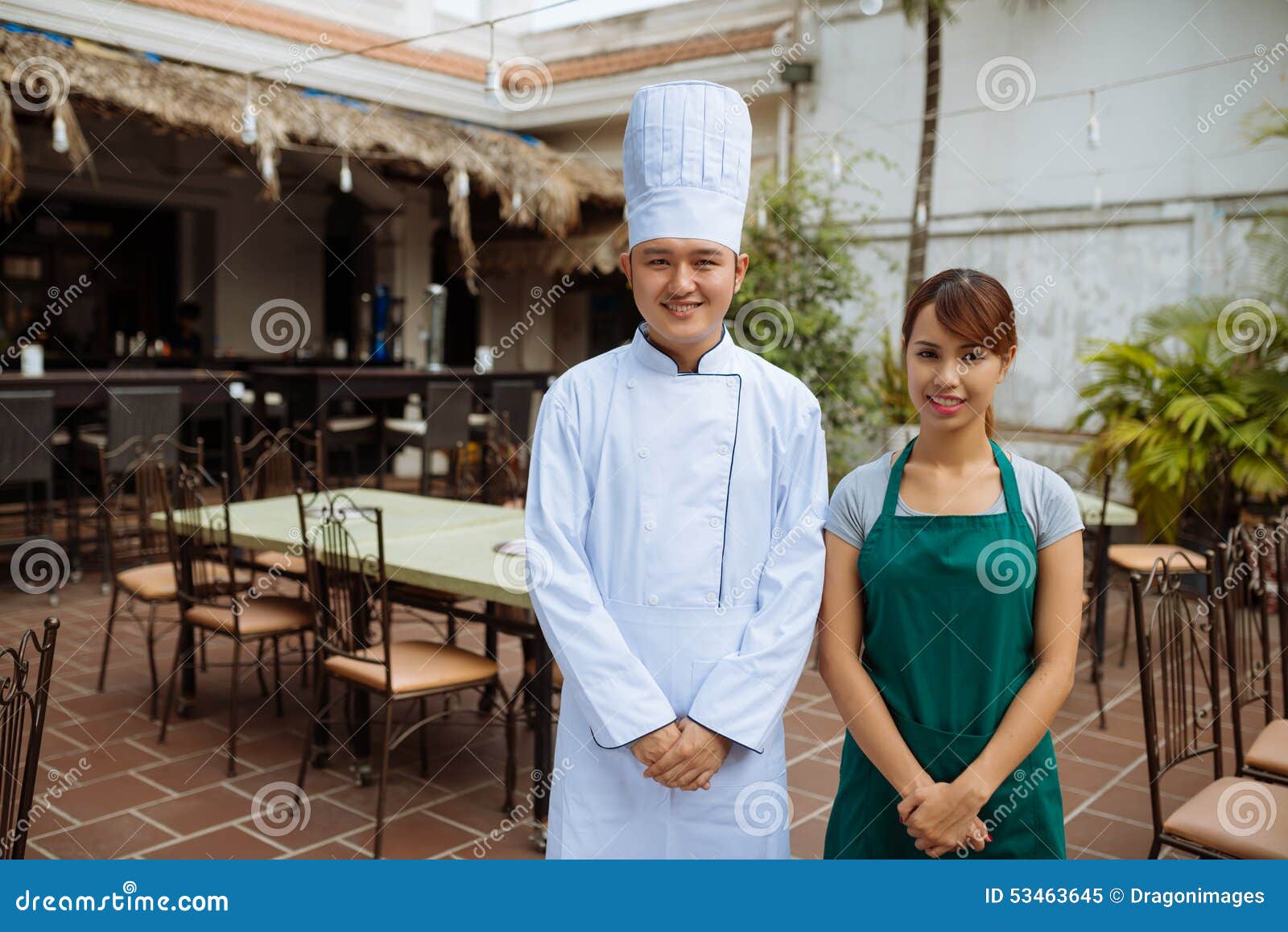 Asian chef and a waitress stock image. Image of waitress - 53463645