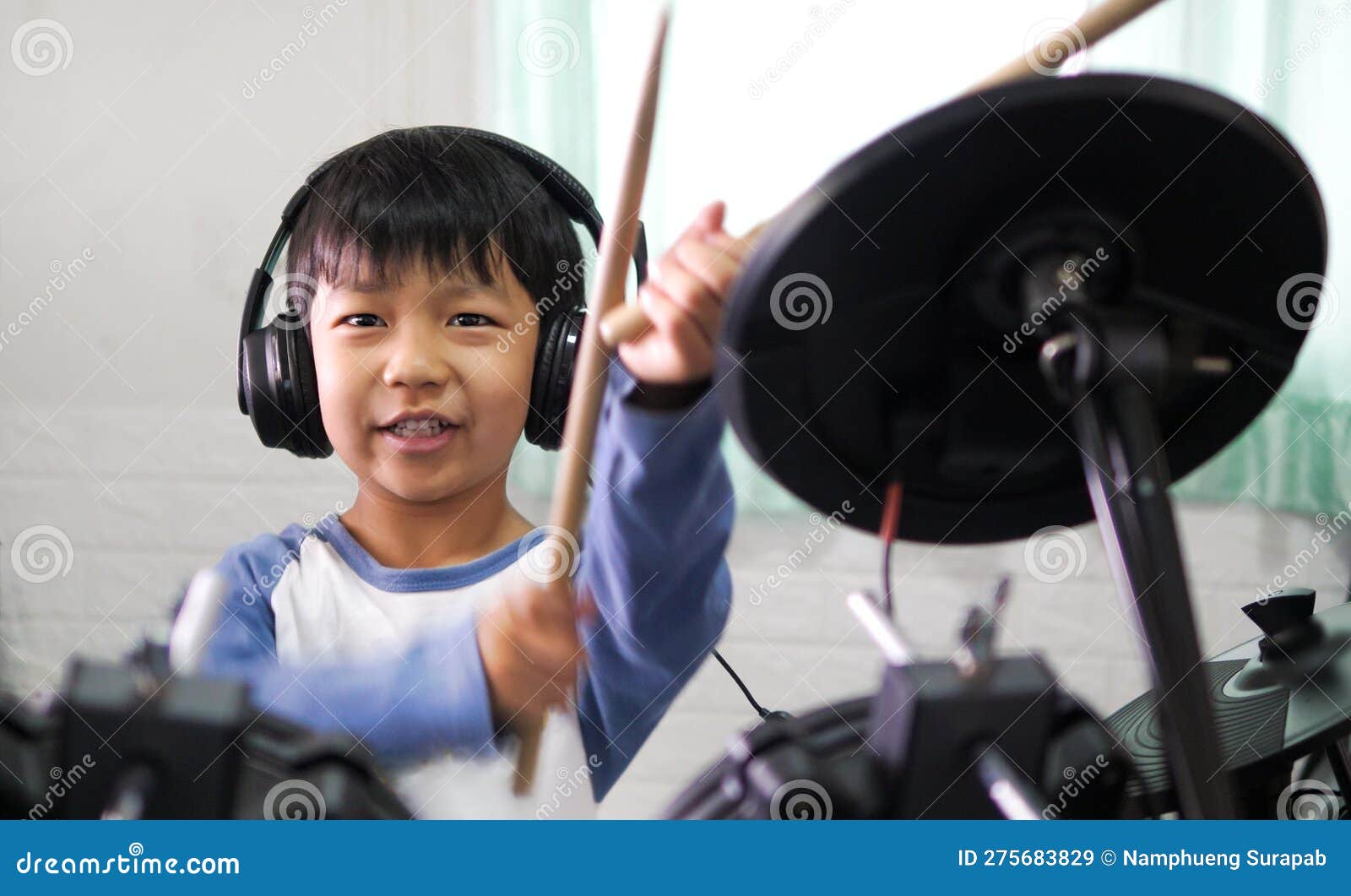 Asian Child Boy Hold Drumstick To Play Electronic Drum with Headphone ... Asian Child Boy Hold Drumstick To Play Electronic Drum with Headphone ...